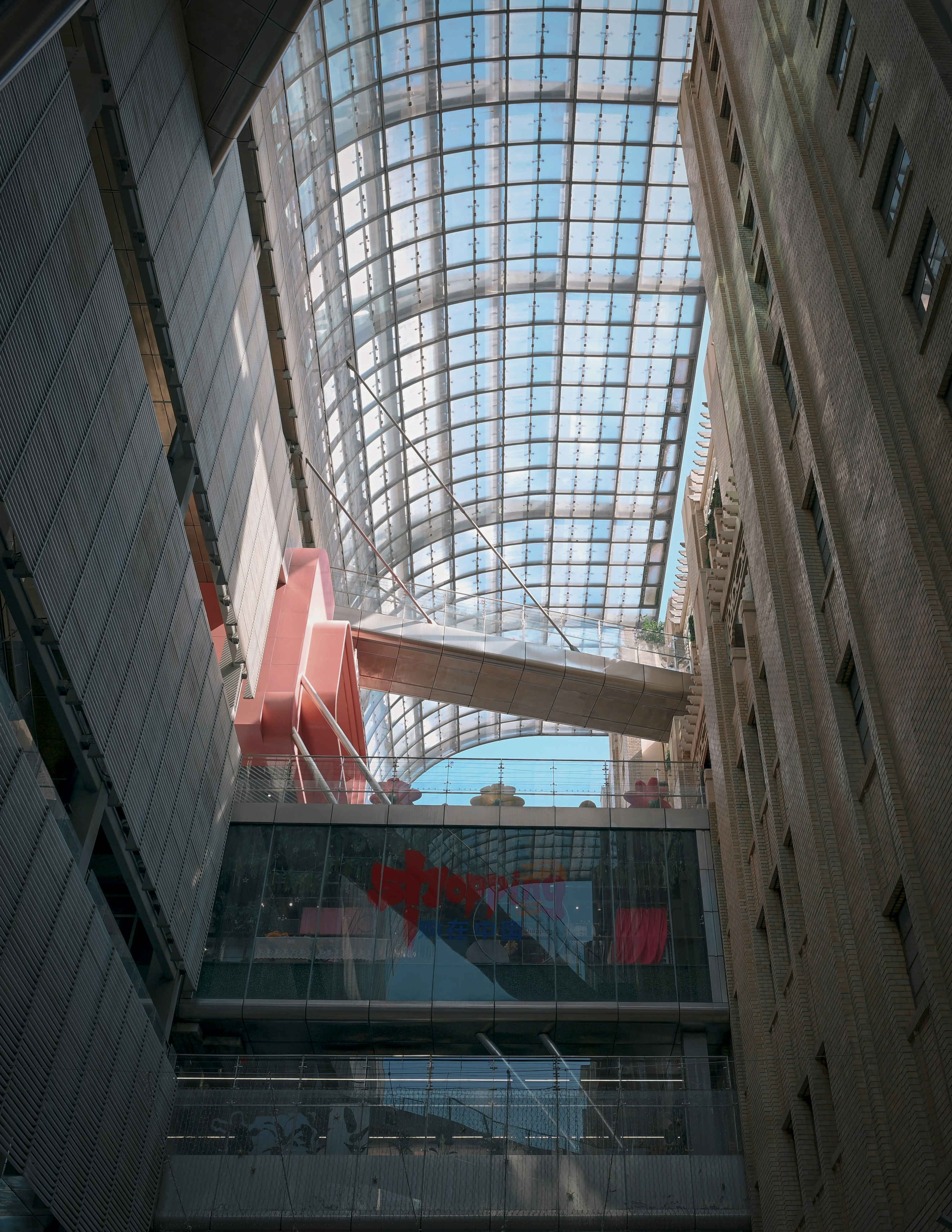 Glass-Ckapped Atrium Under a Painted Sky