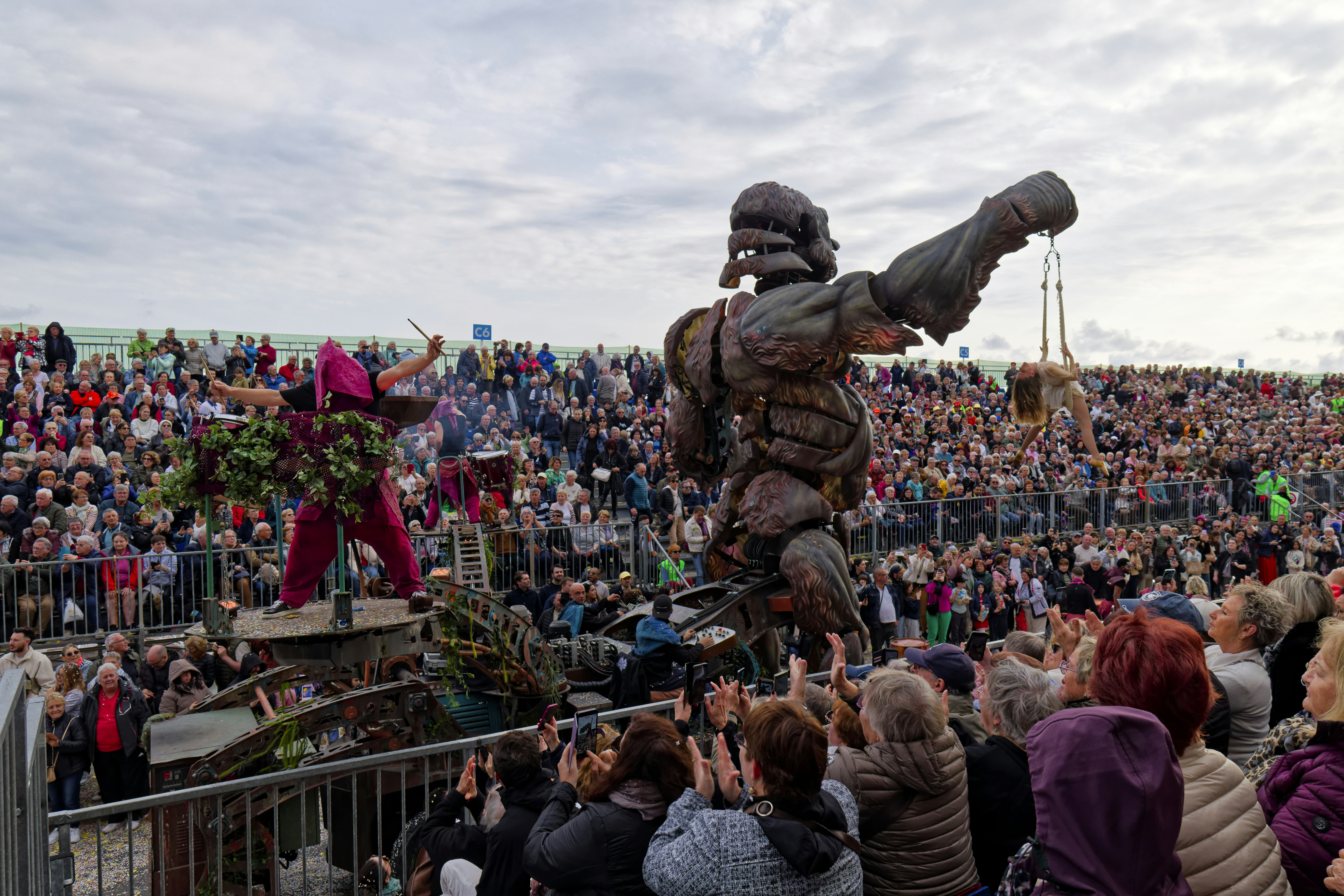 Crowd Surges as Giant Puppet Stages a Farewell Pose During Festival Chaos