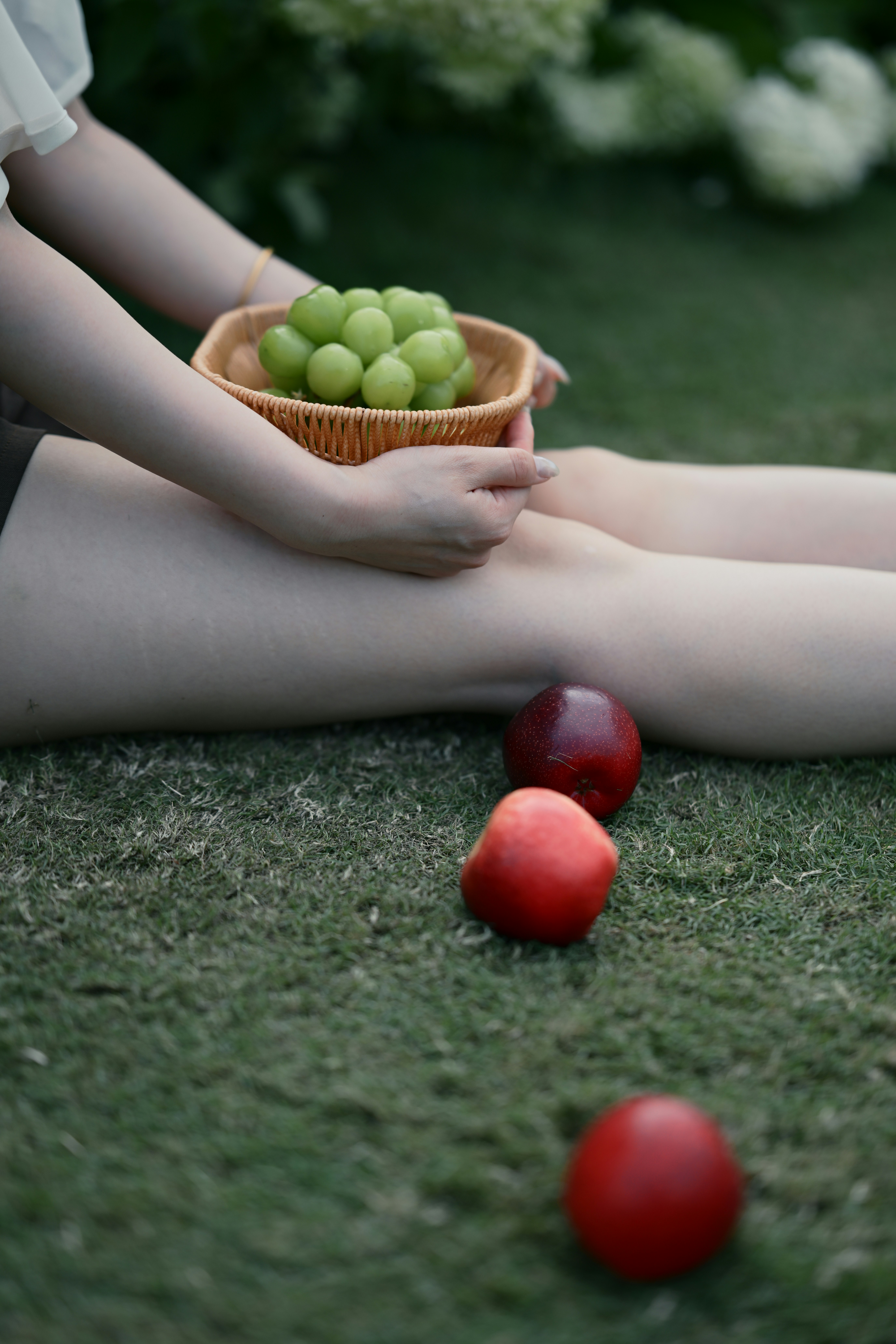 Basket of Green Grapes Resting on a Quiet Picnic Moment