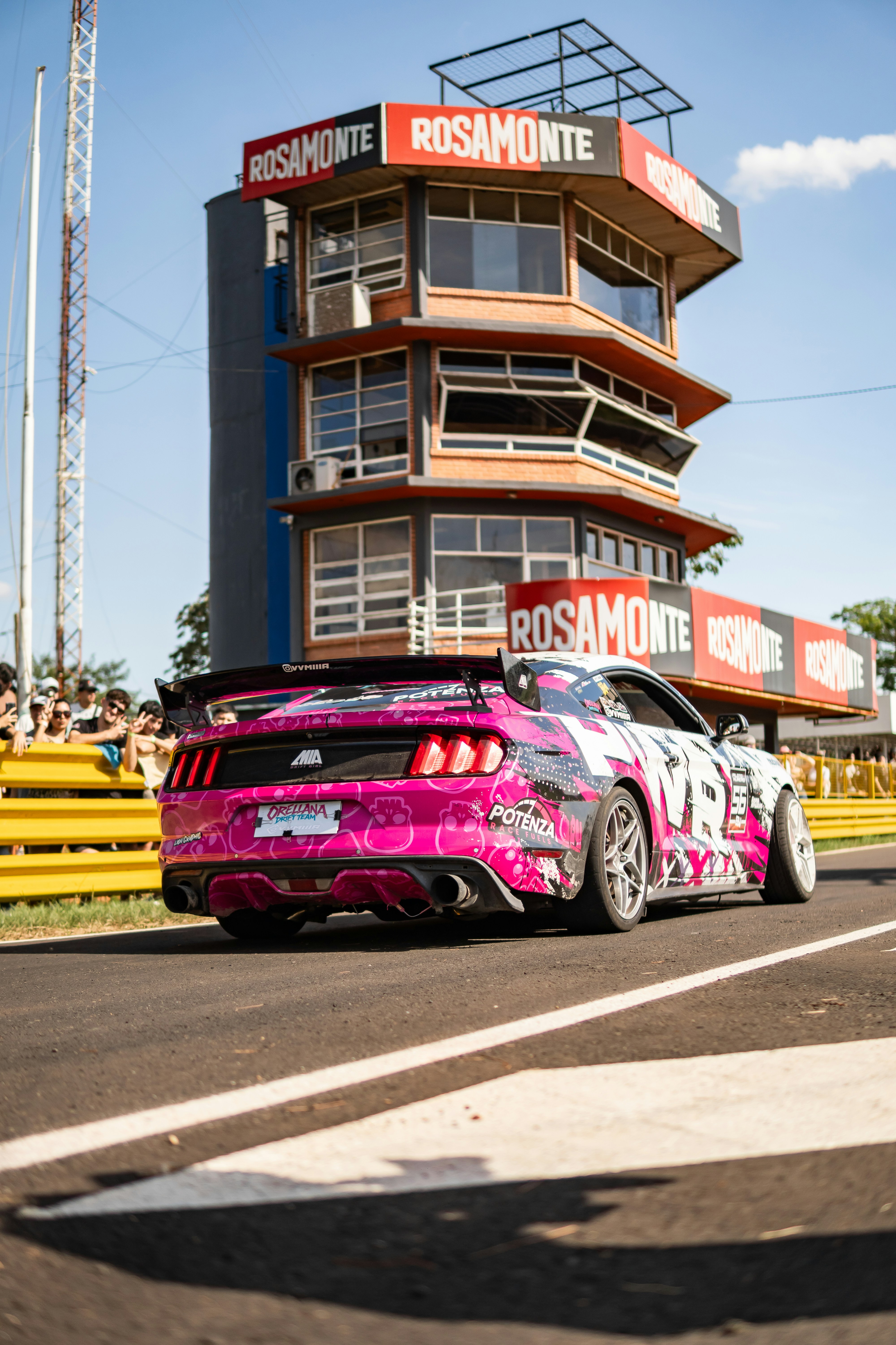 Pink Racecar at the Rosamonte Tower in a Sunlit Circuit