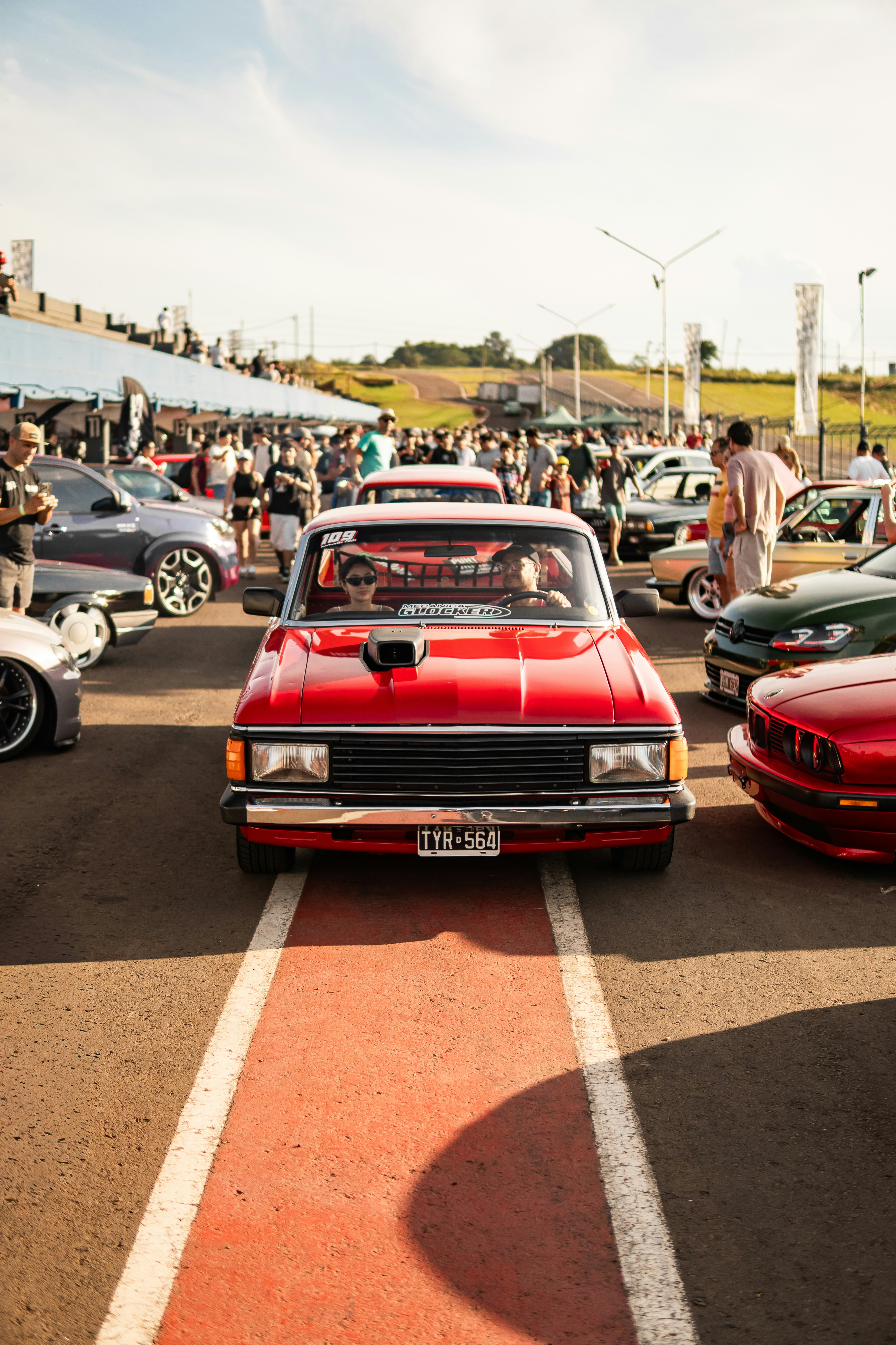 Red Brilliance at the Car Show: A Central Classic