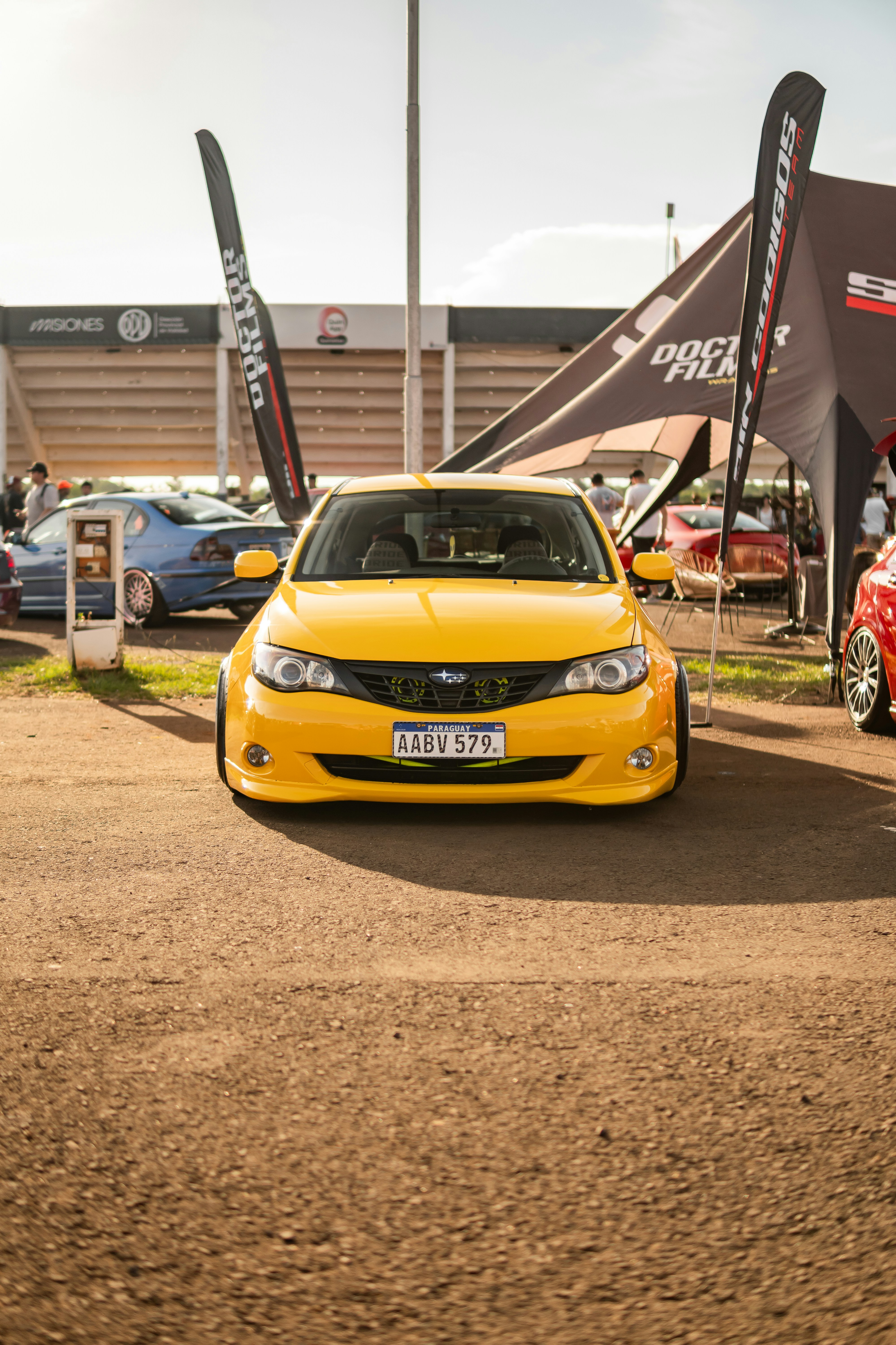 Golden Stance: The Yellow Car at the Car Show