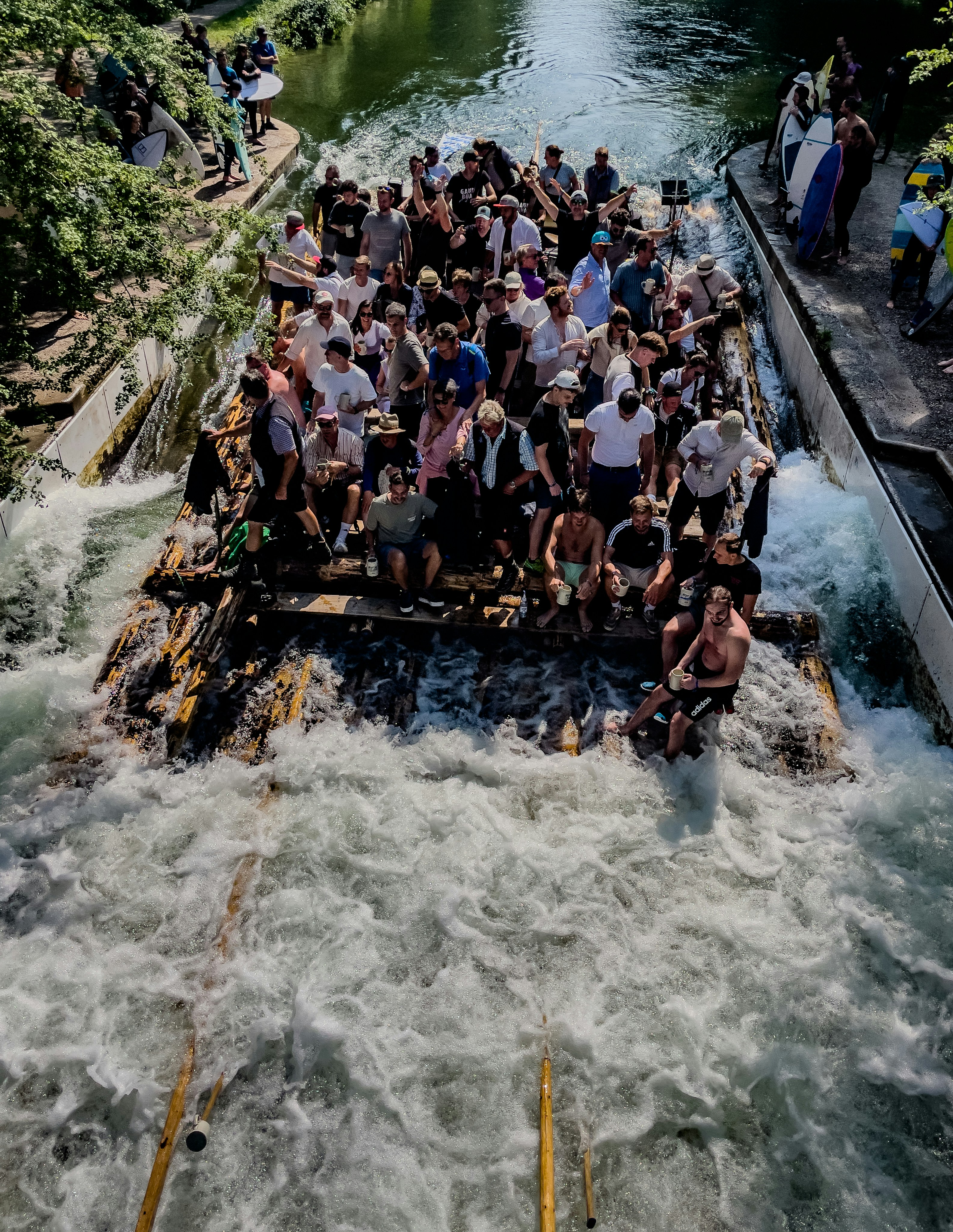 Crowded raft plunging through whitewater