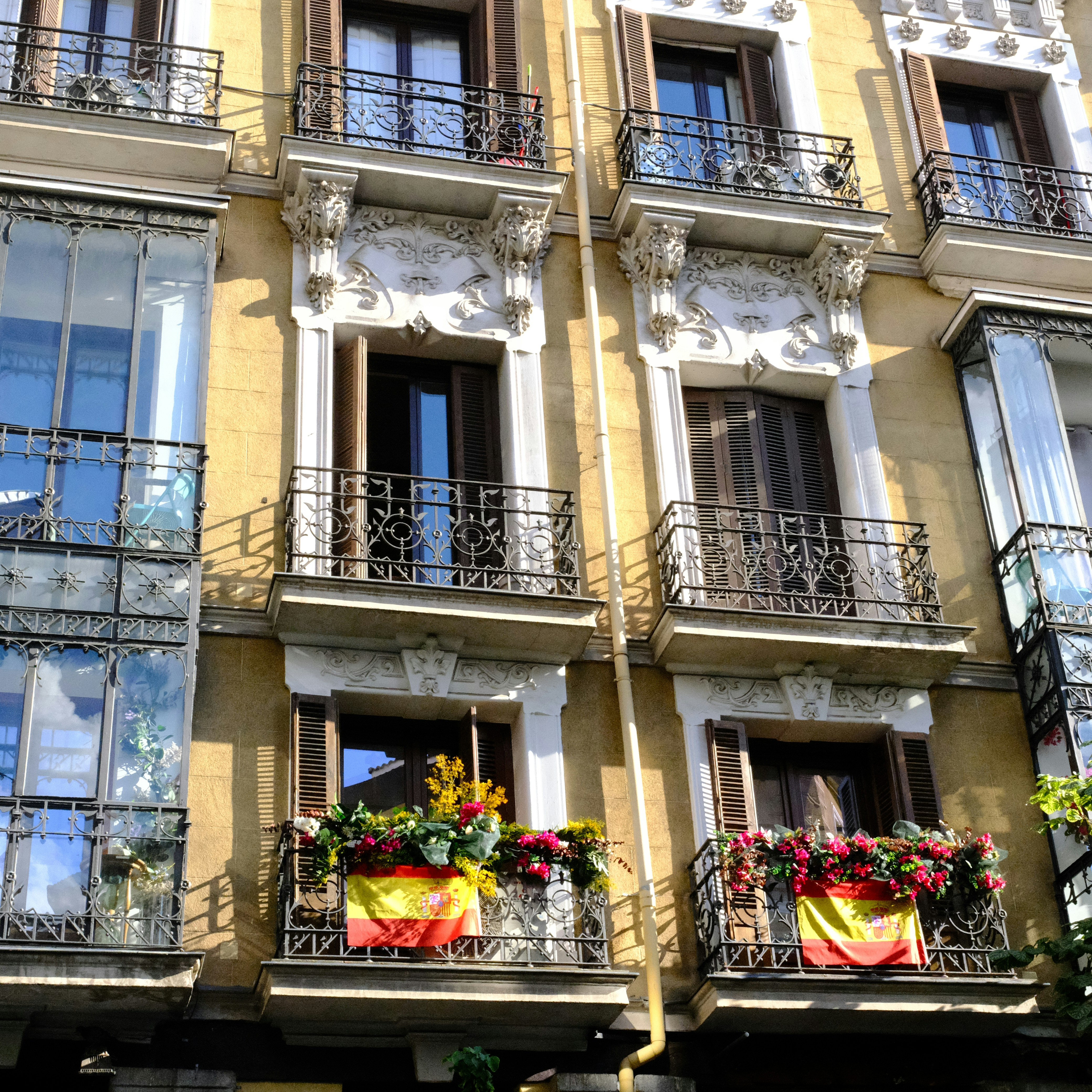 Ornate Balconies in Sunlit Avenida