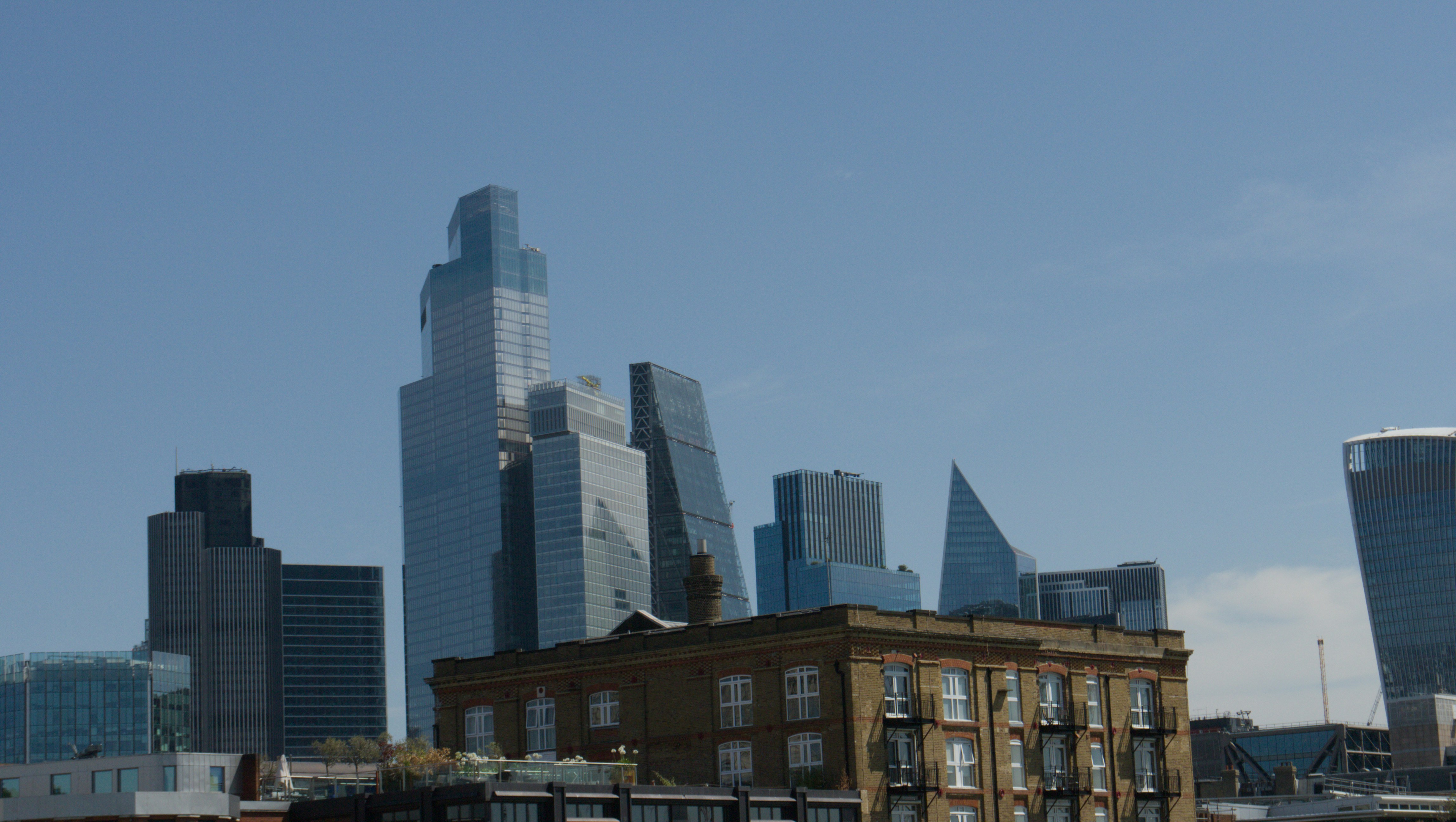 City Crest: Brick Townhouse Beneath a Skyline of Glass