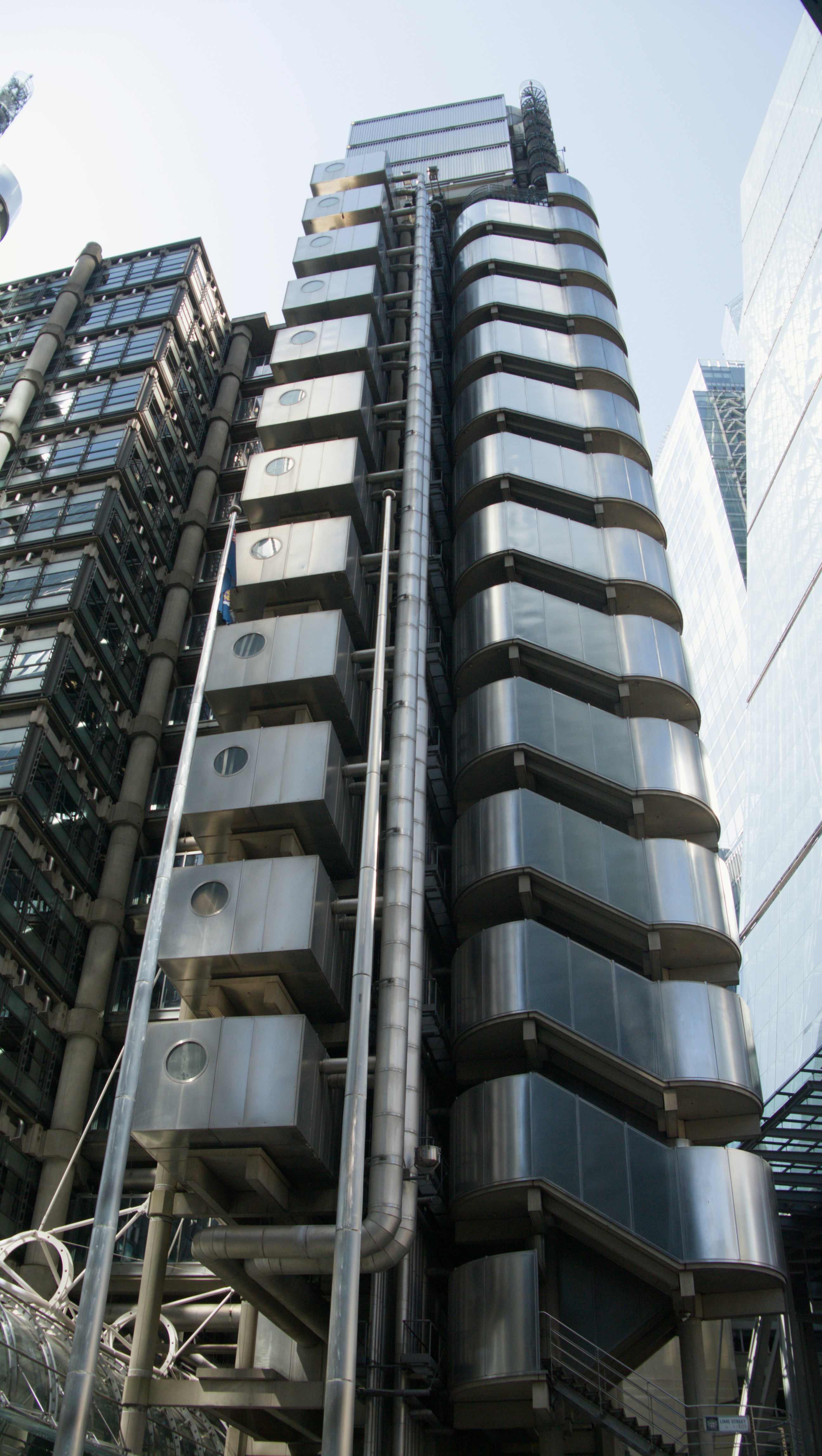 Industrial Facade Ascending: a Columnar Tower with Exposed Pipelines
