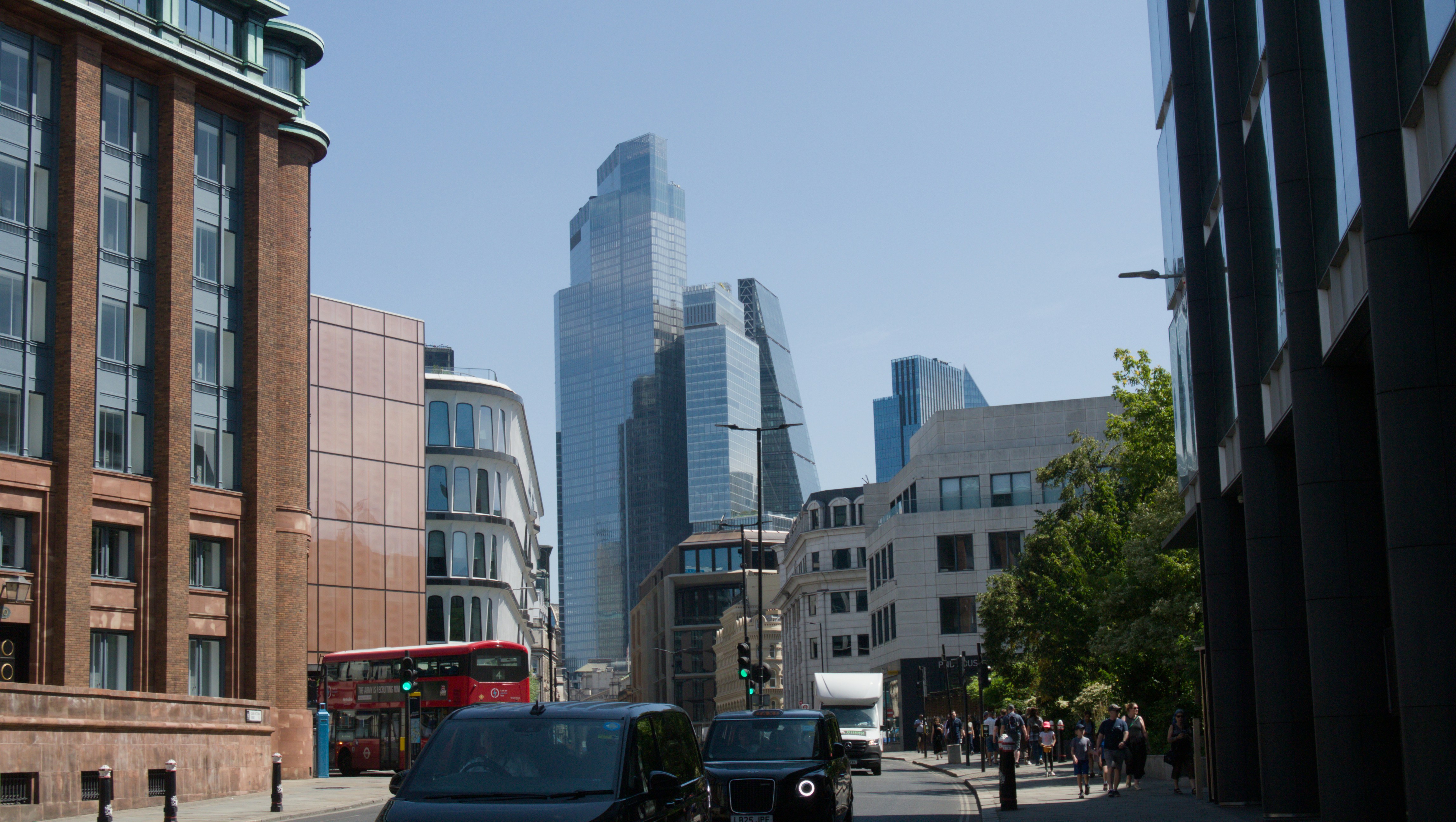 Urban Skyline Convergence: Street-Level View Toward Towering Glass