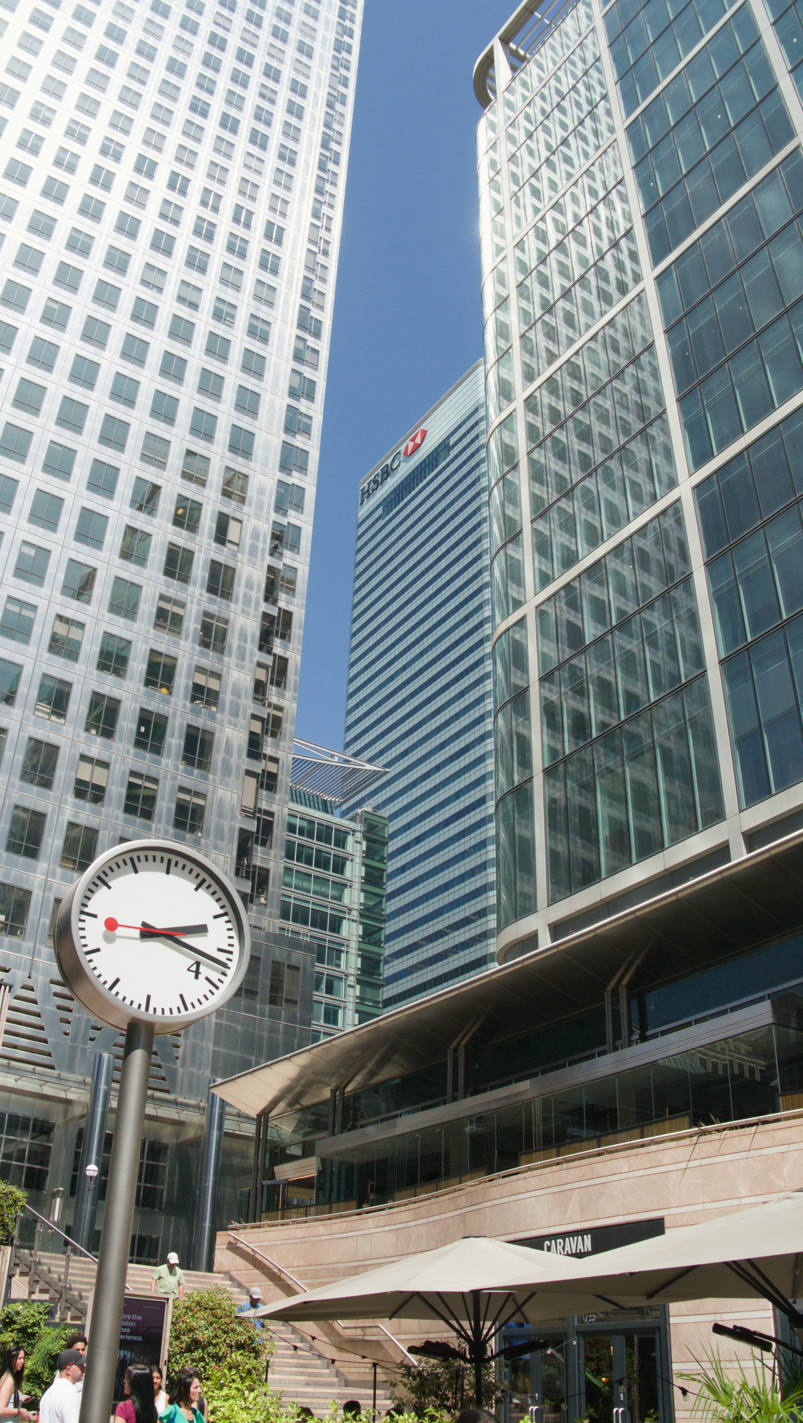 Urban Clocktower Under Glass Giants