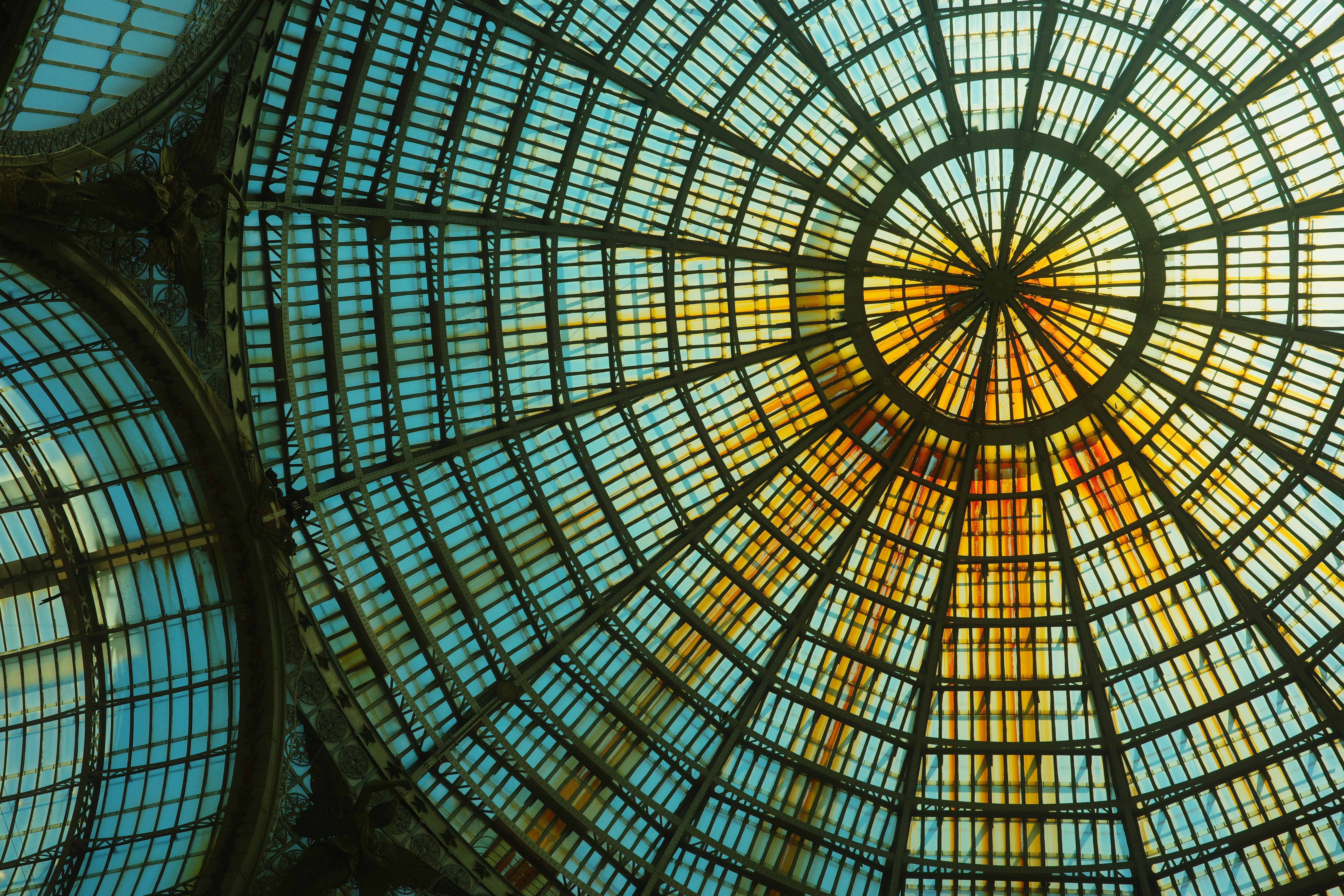 Powdered sunburst through a vaulted glass dome