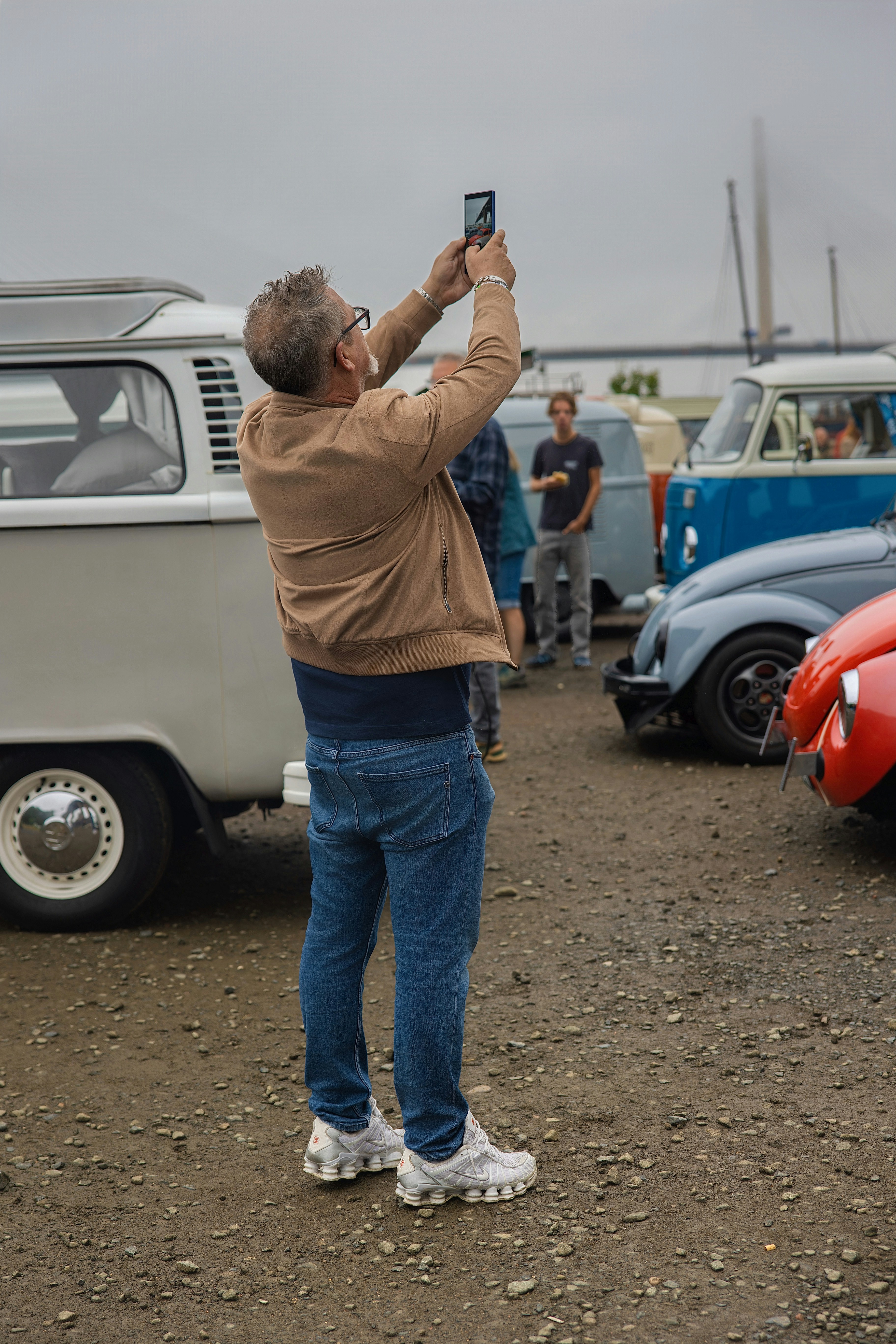 Capturing the Moment: A Retro Car Meet Echoes with a Smartphone Selfie