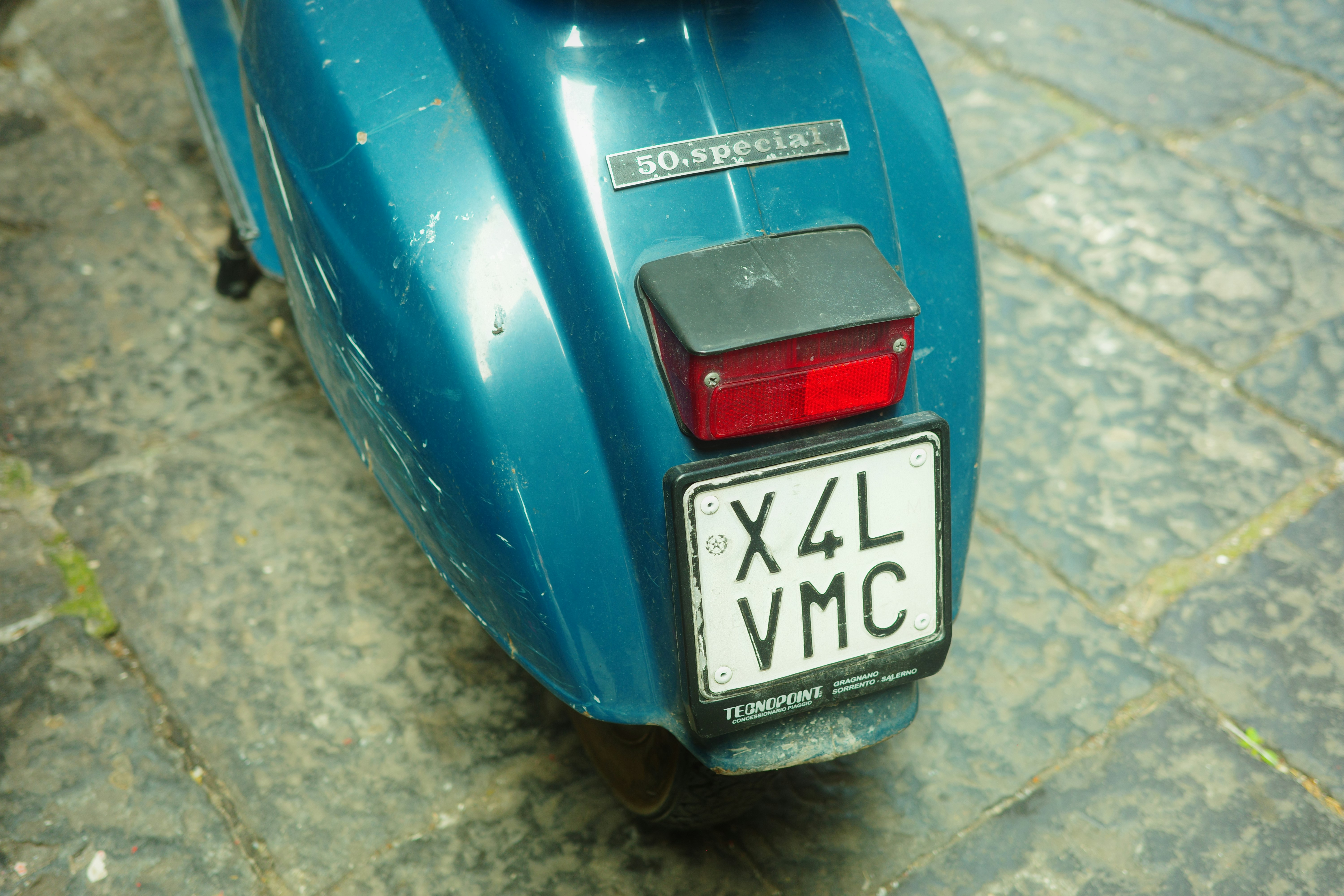 Blue Vespa Tail: A Close Encounter with the Classic Ravaged by Time