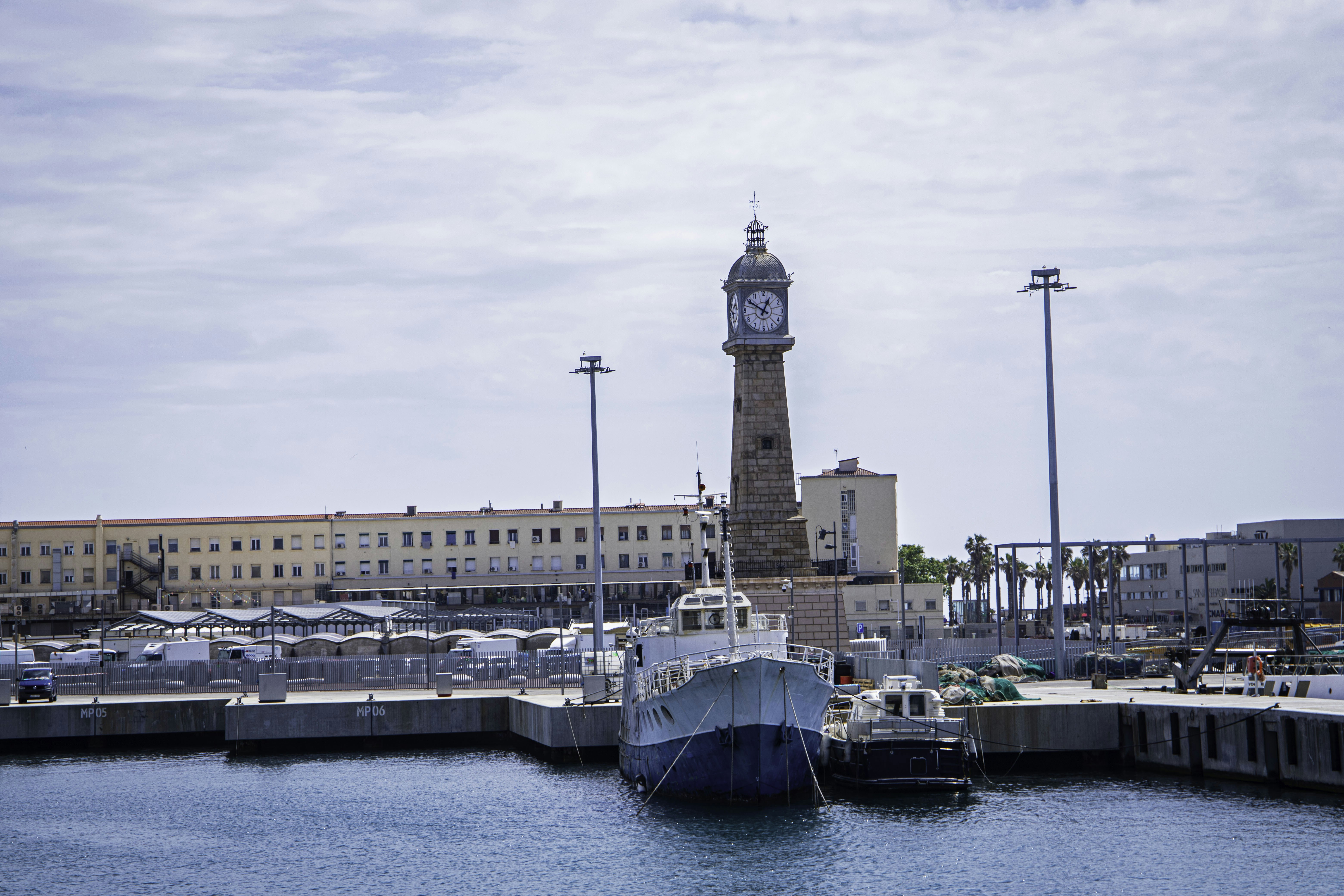 Harbor Clock Tower: Time Stands Over Calm Waters