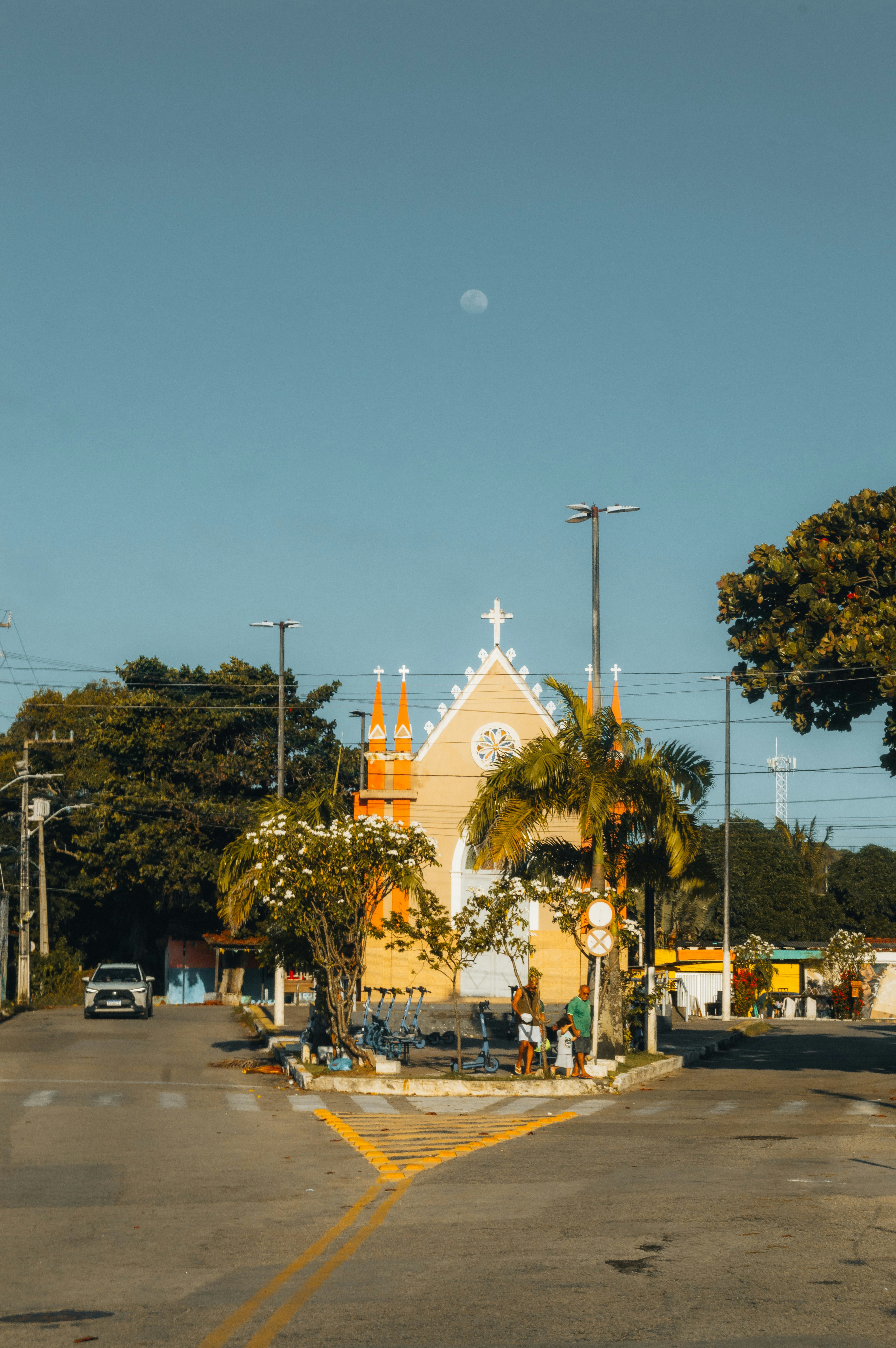 Sunlit Chapel at the Crossroads of a Quiet Town