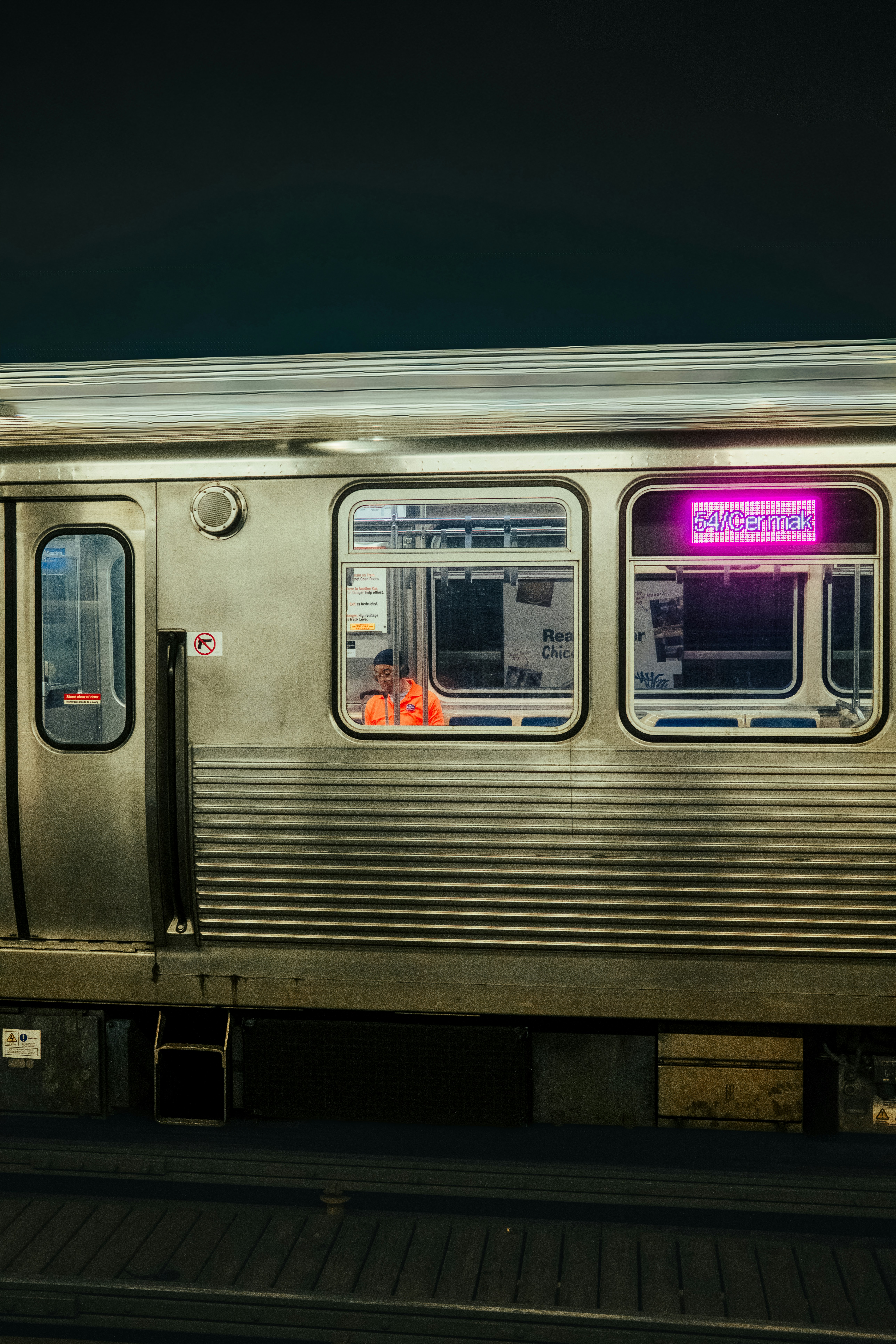 Subway Window Stories: A Quiet Moment in Stainless Steel