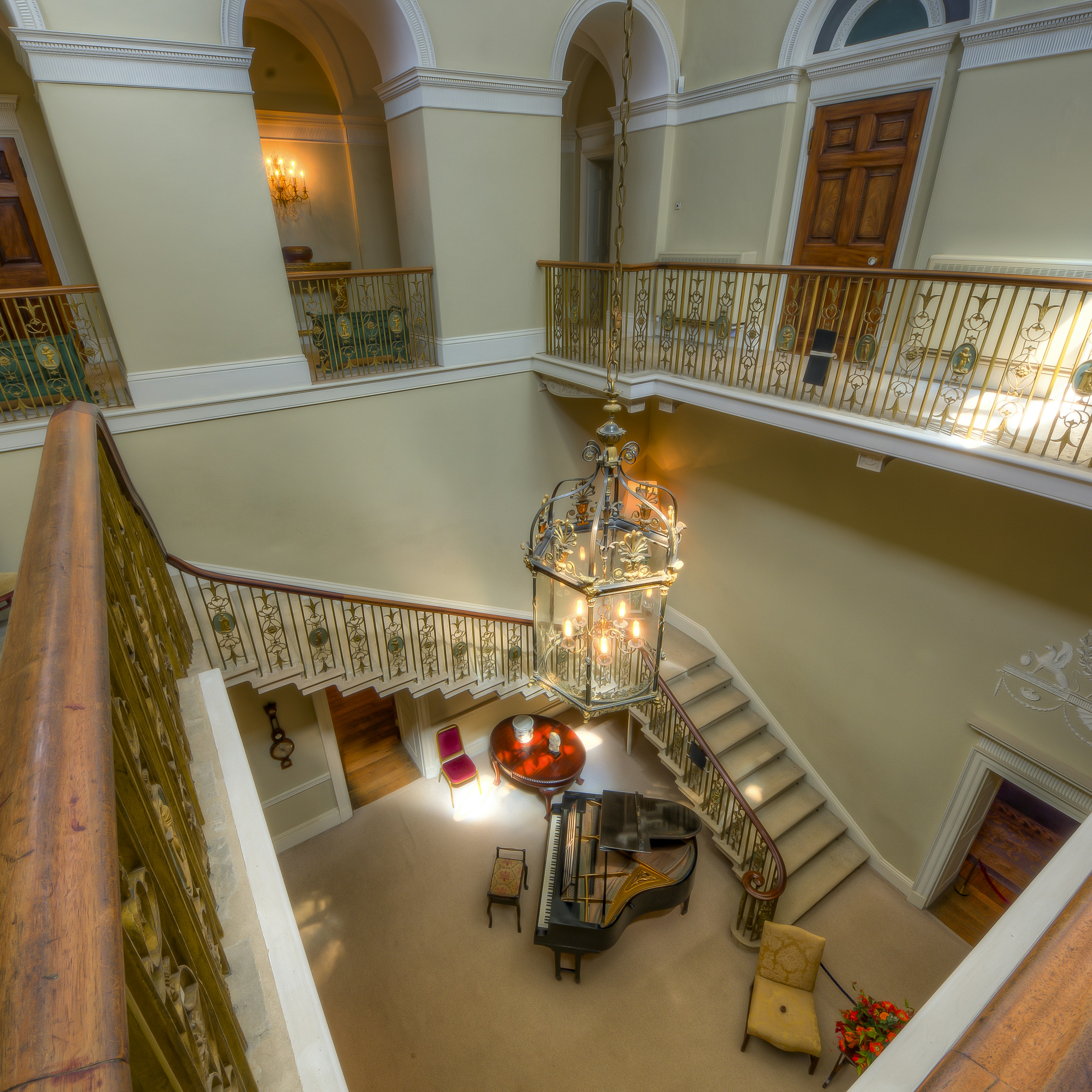 Chandelier Glow Over a Grand Stair: A Quiet Atrium Portrait