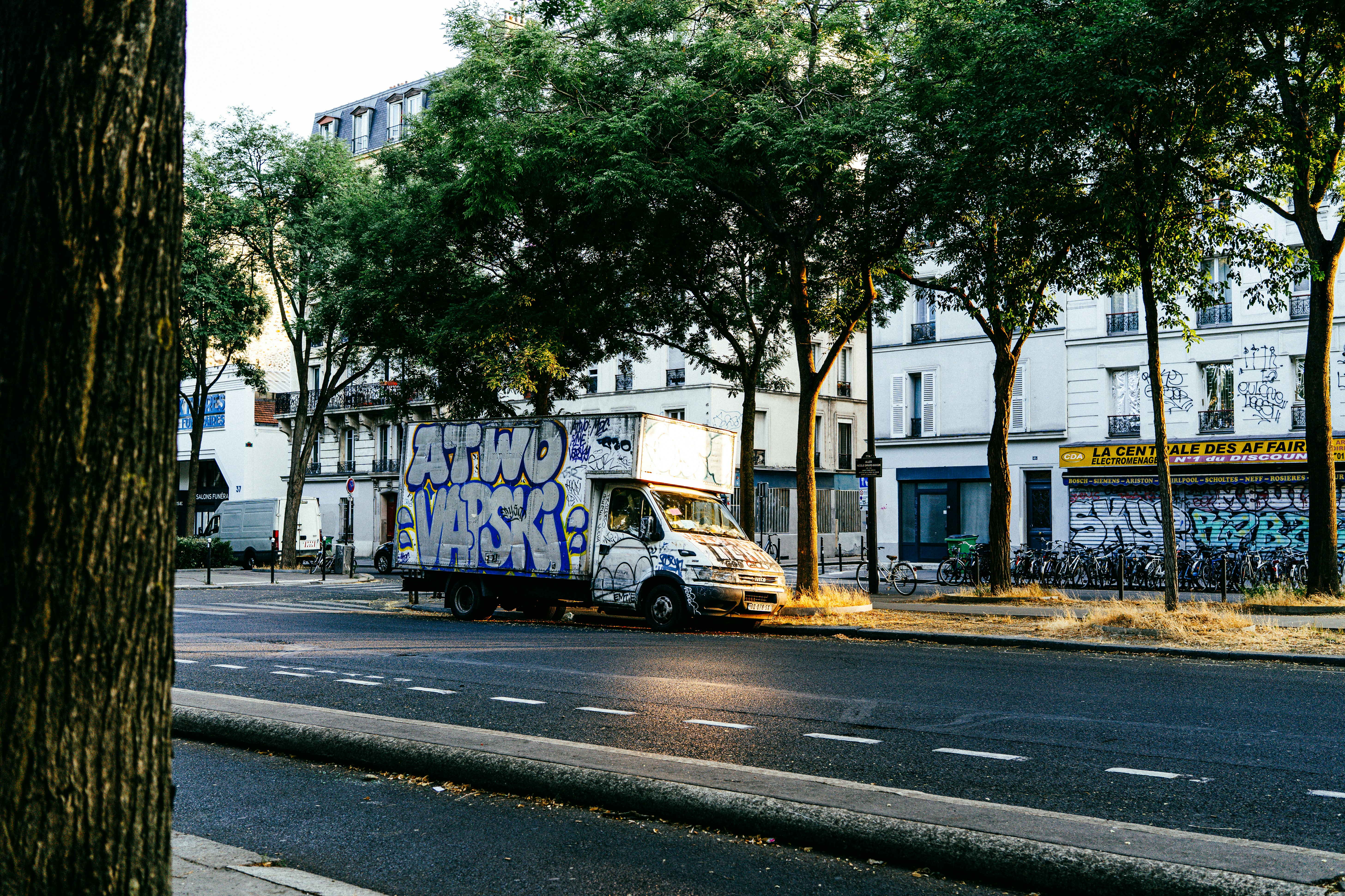 Graffiti Truck Under the City Trees