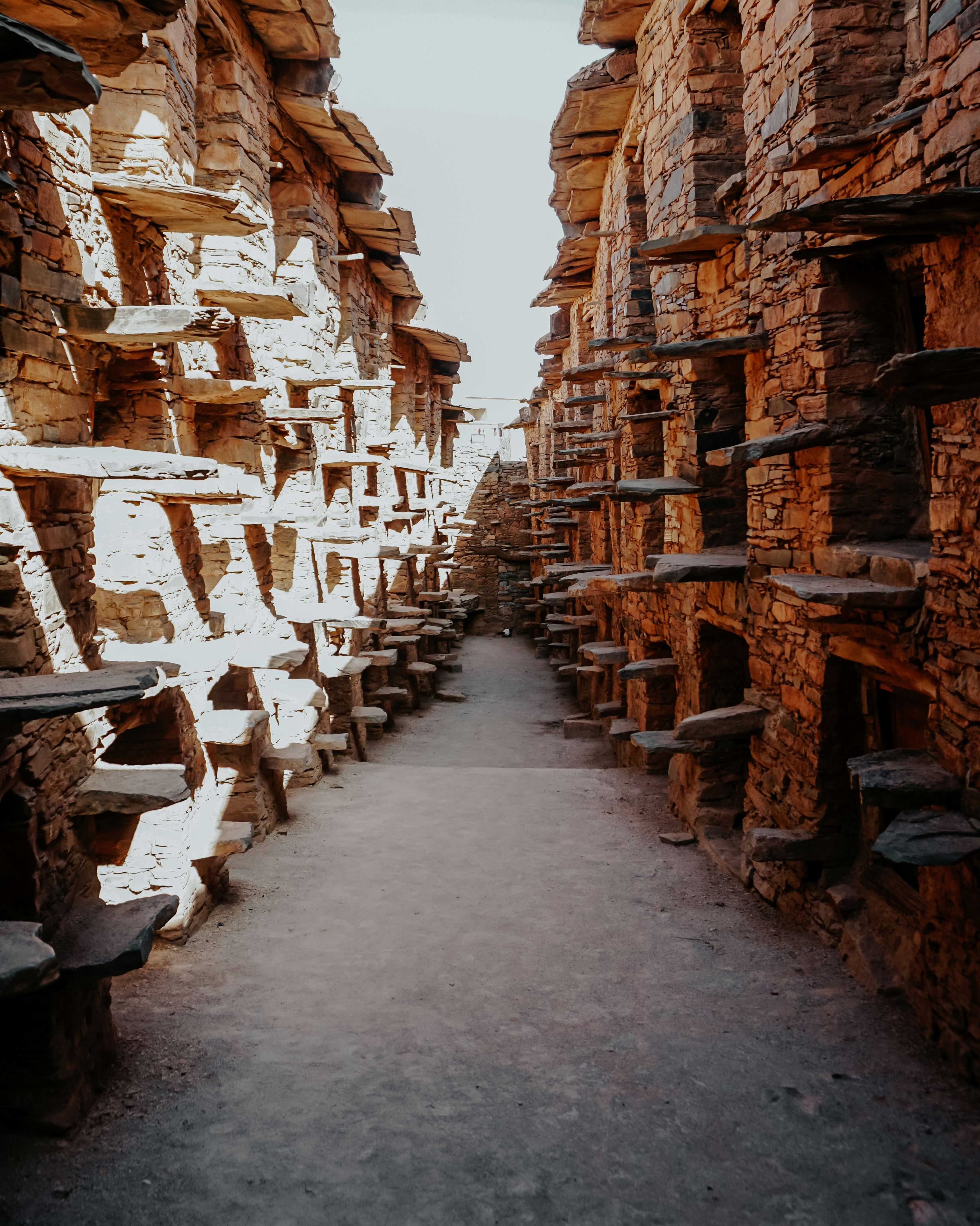 Stone Alley: Towers of Echoed Shelves Reaching the Horizon