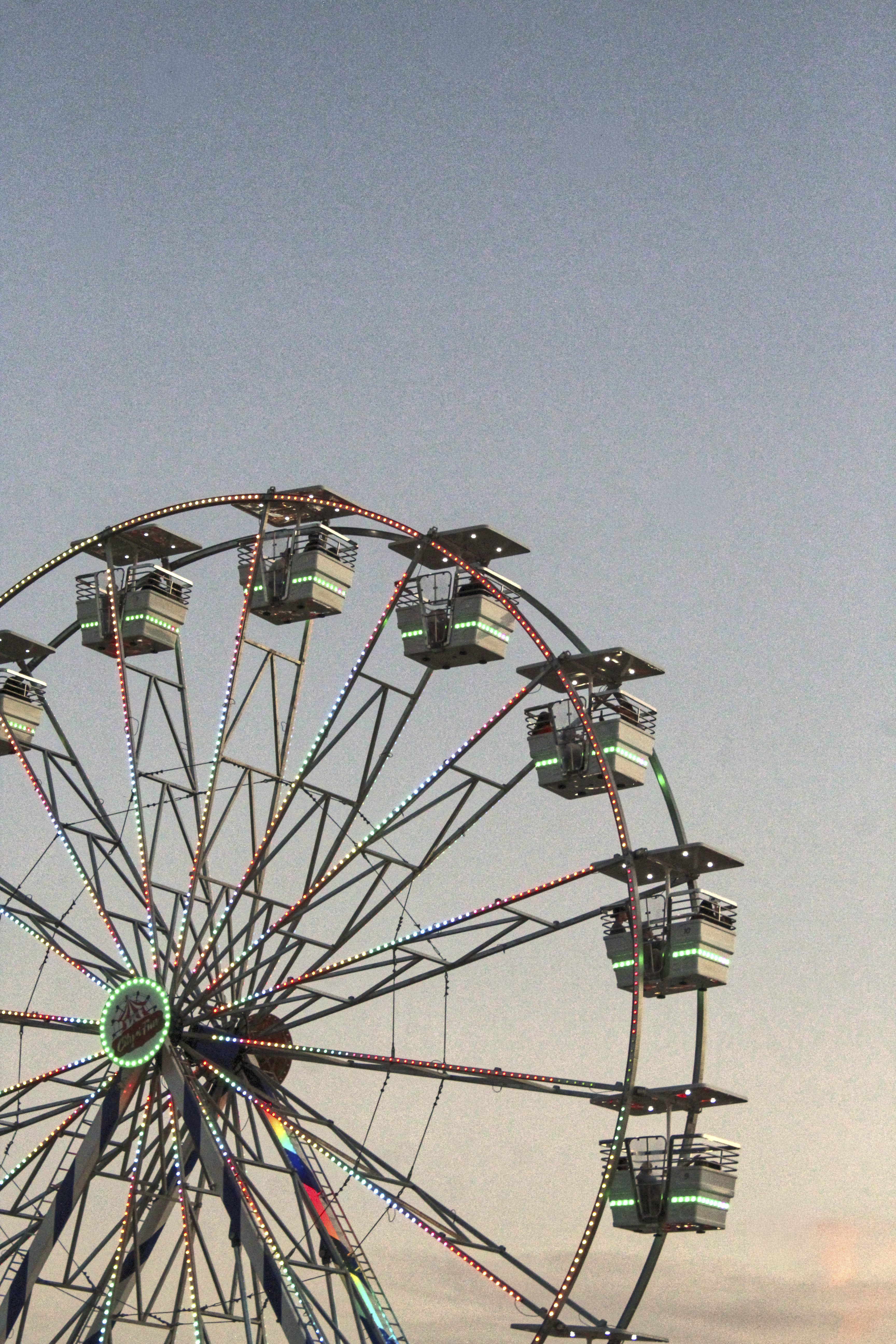 Circular Light: A Ferris Wheel Looms Over the Sunset