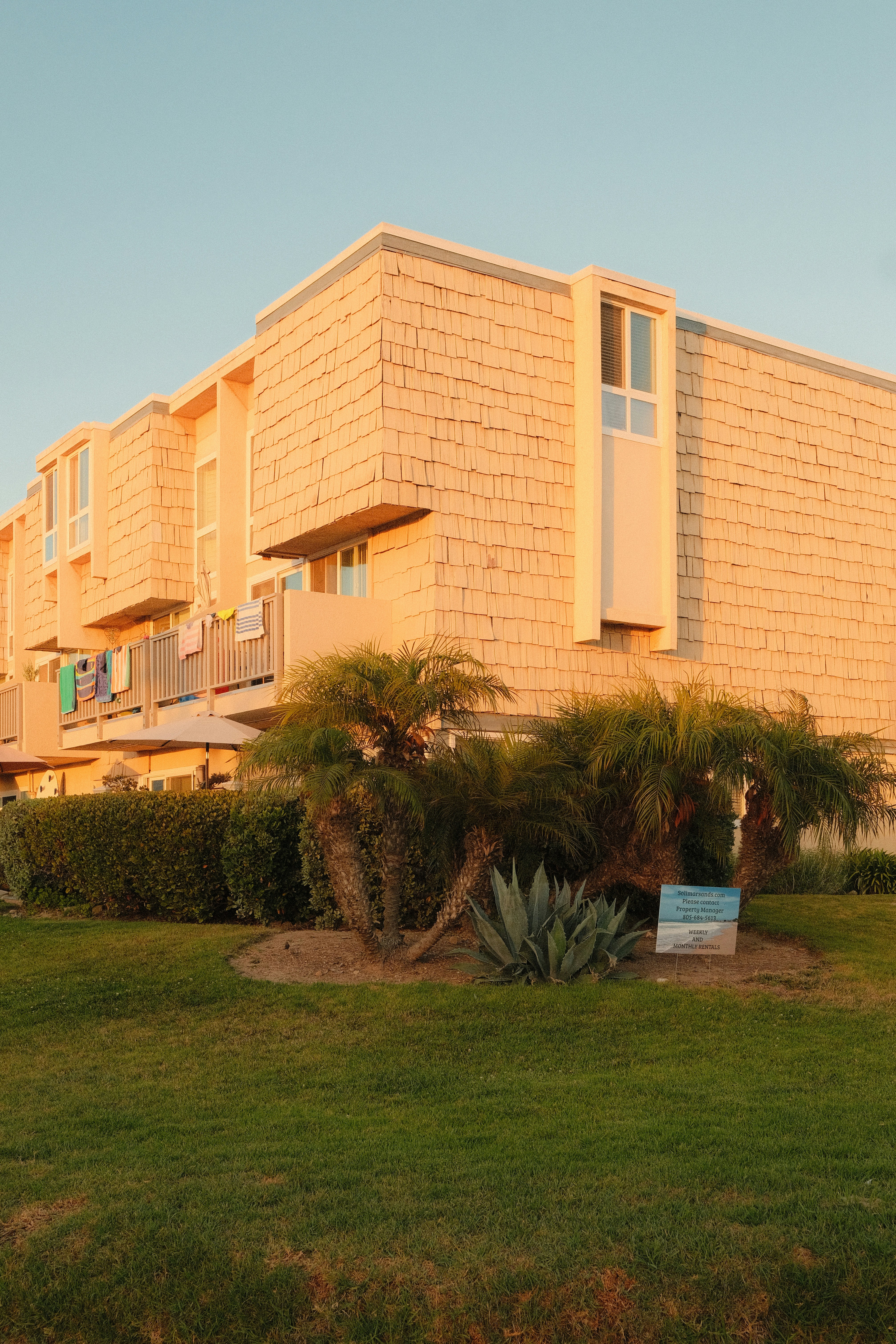 Sunlit Beachfront Apartment Block at Golden Hour