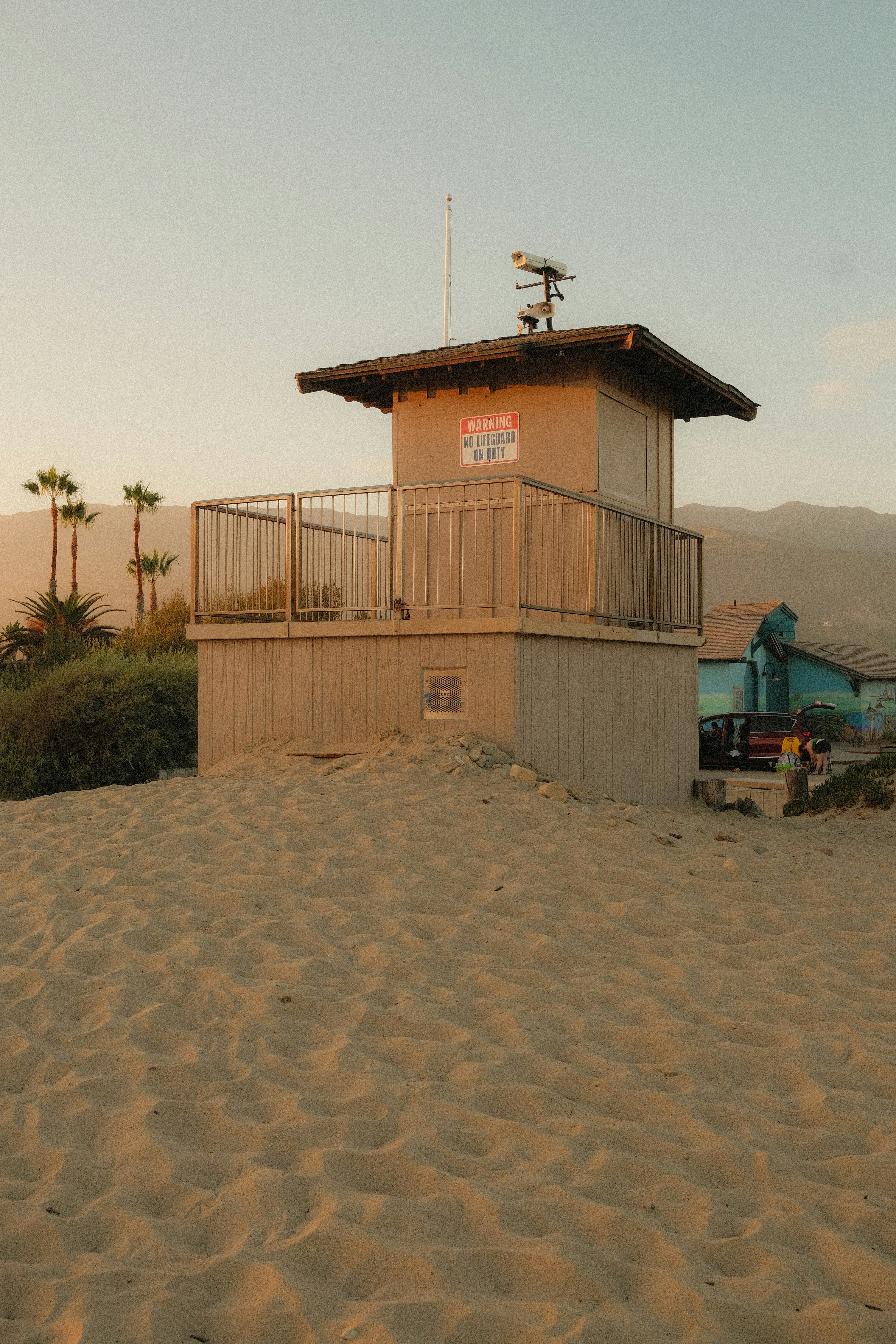 Lifeguard Tower on Warm Sand at Dusk