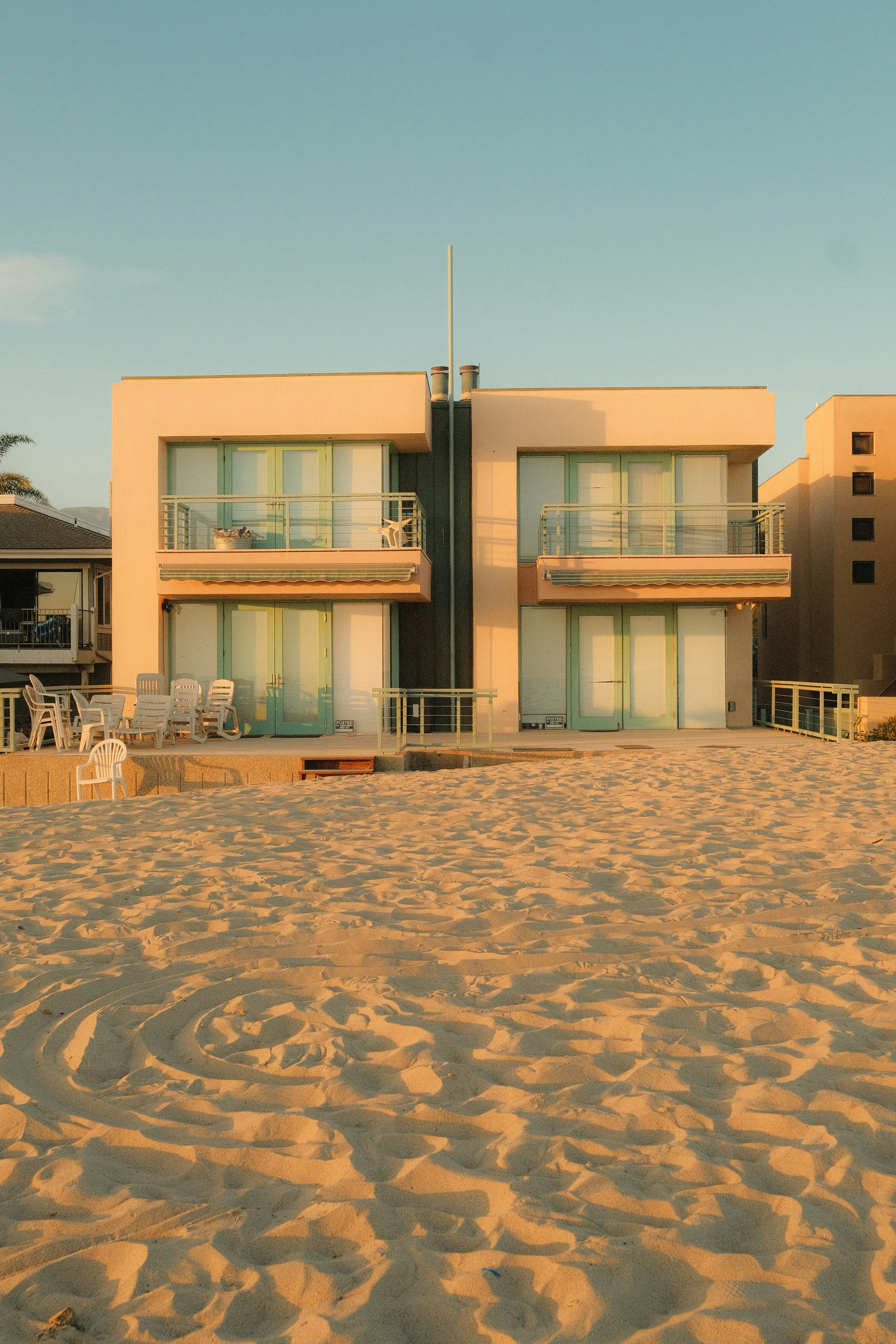 Beachfront Villa Lights: Sunset Quiet Over Sandy Steps