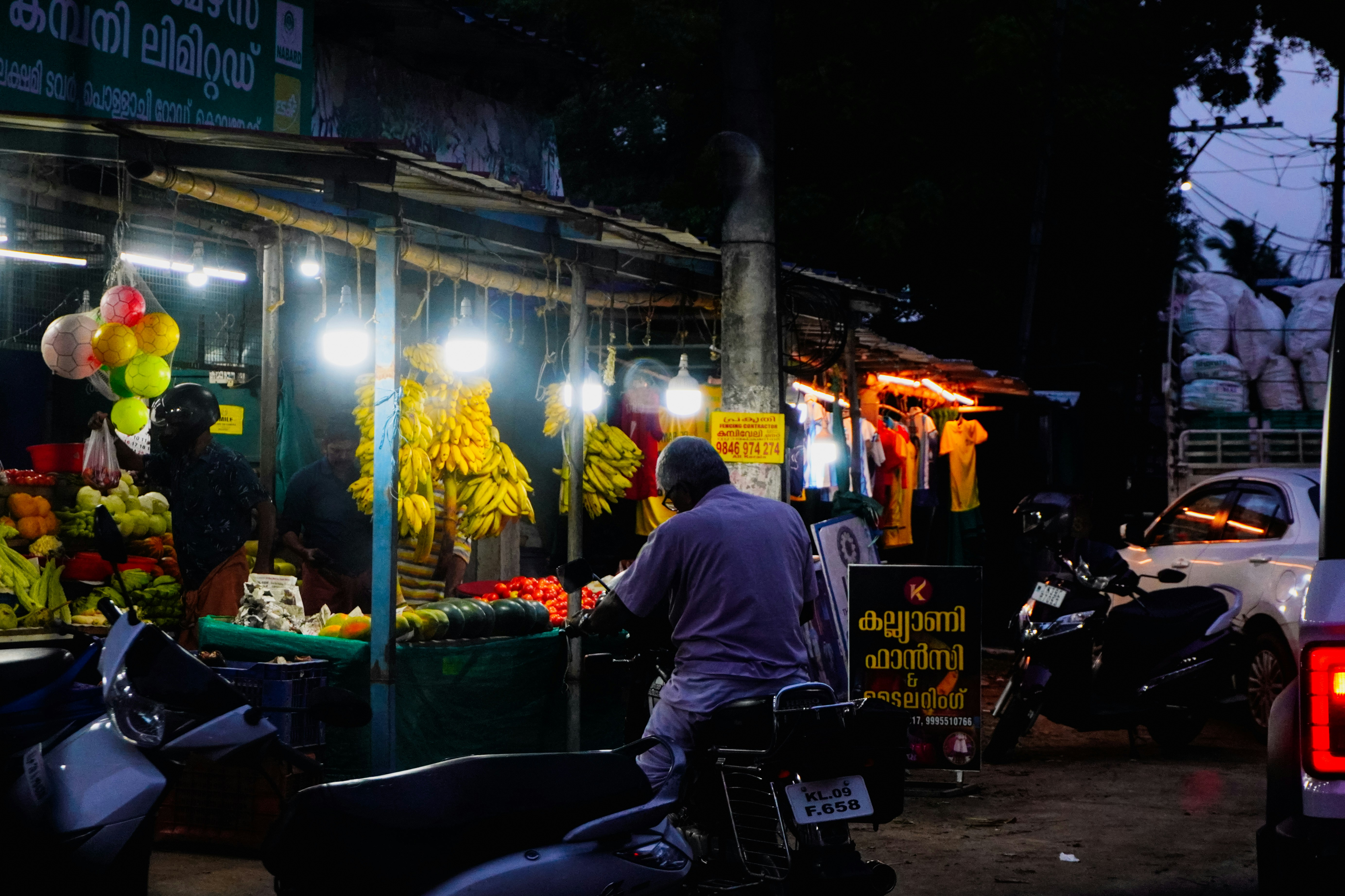 Night Market Glow: A Food Stall Illuminated by Hanging Bulbs