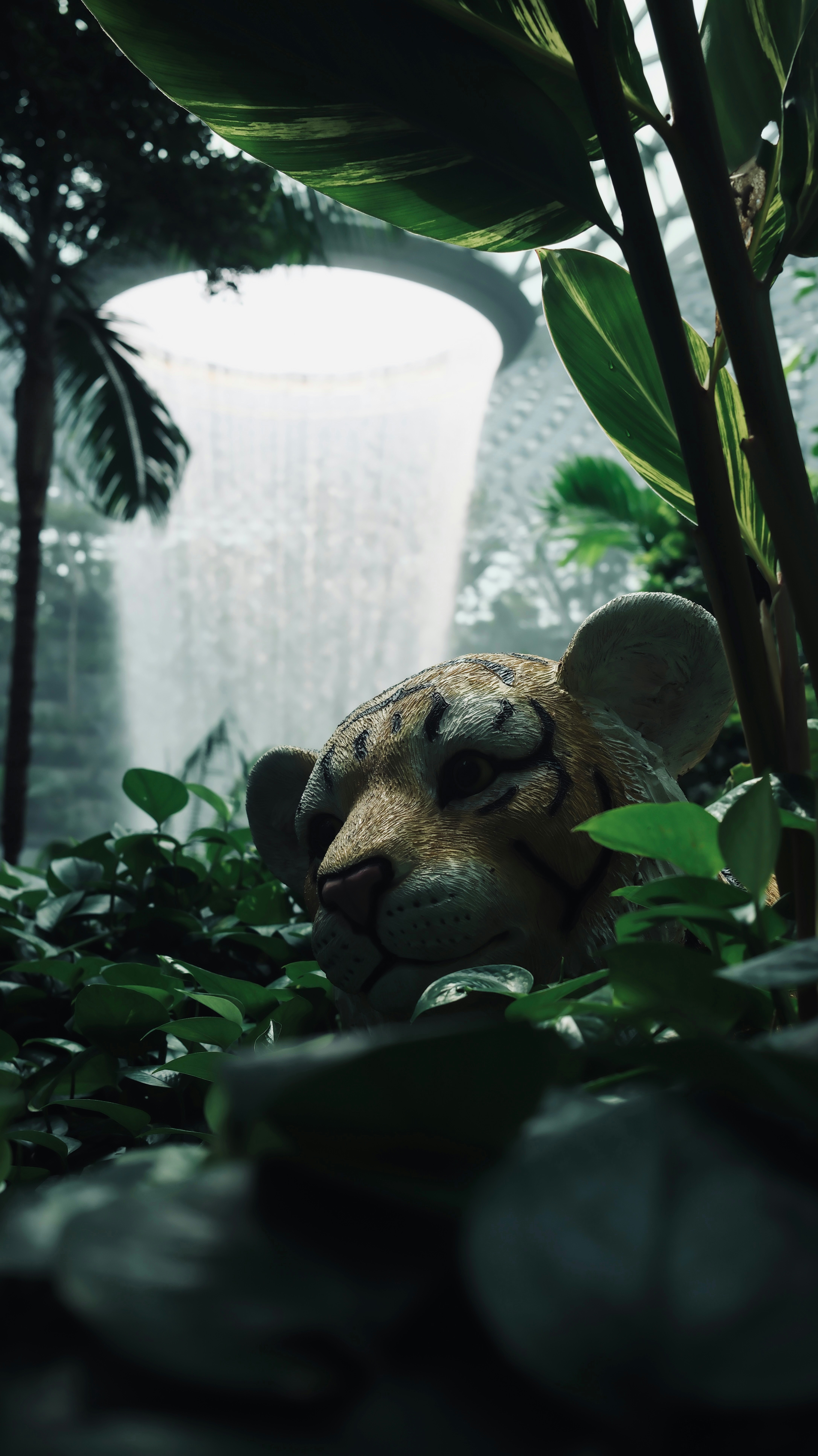 Hidden Predator Among Green Veil: Tiger at Rest by a Waterfall