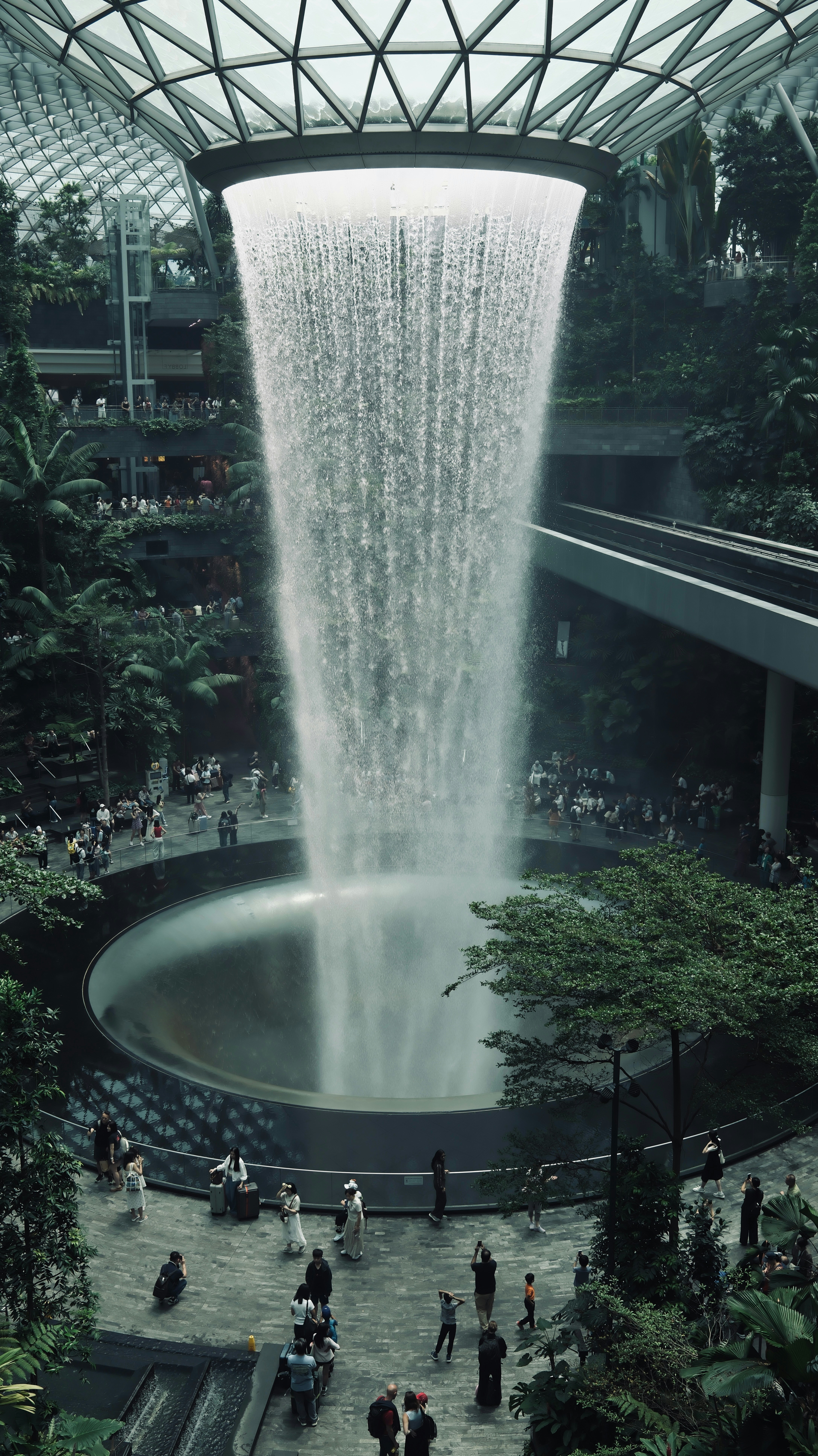 Giant Indoor Curtain: A Towering Waterfall Within a Glass Atrium