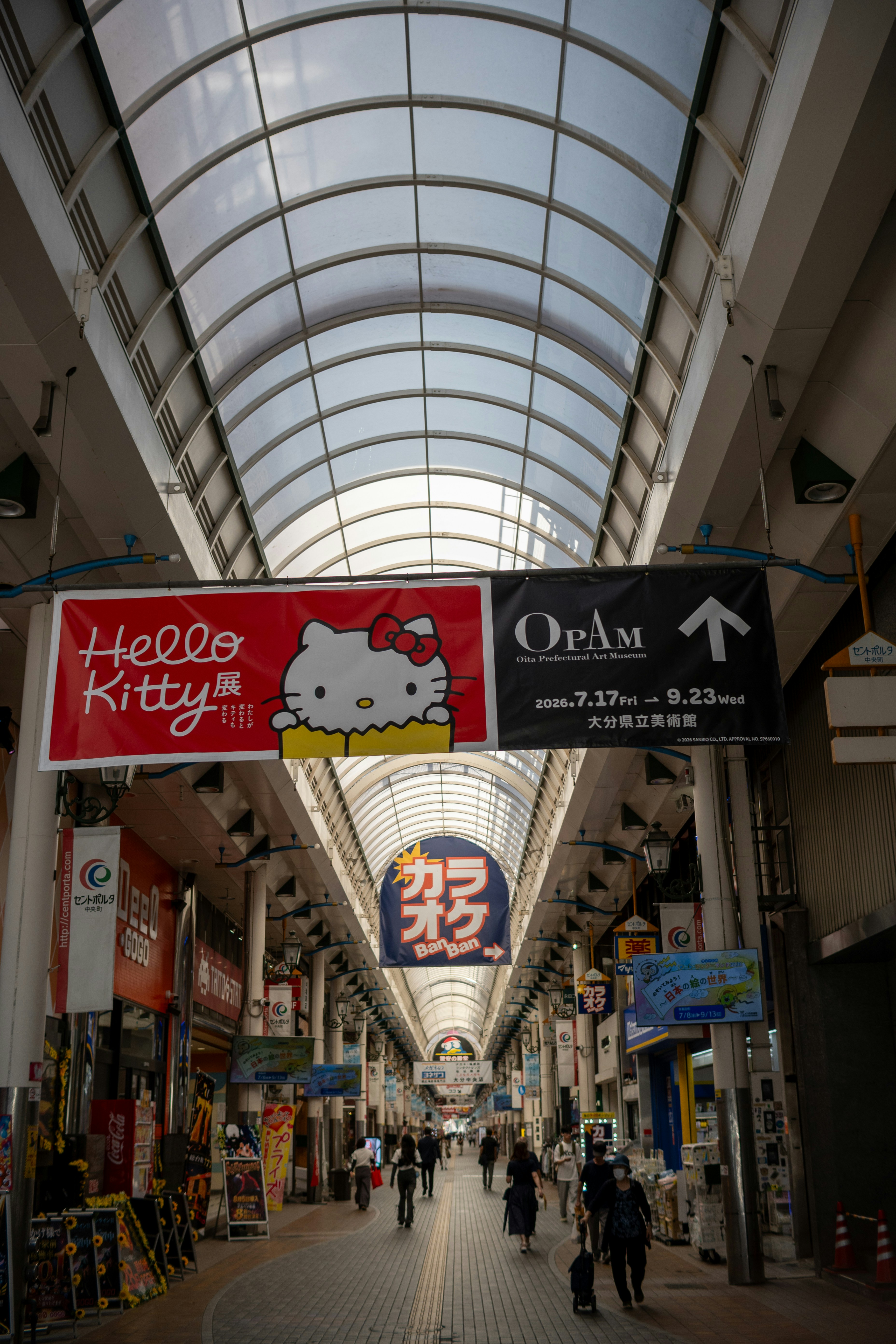 Hello Kitty Banner Over a Sunlit Arcade