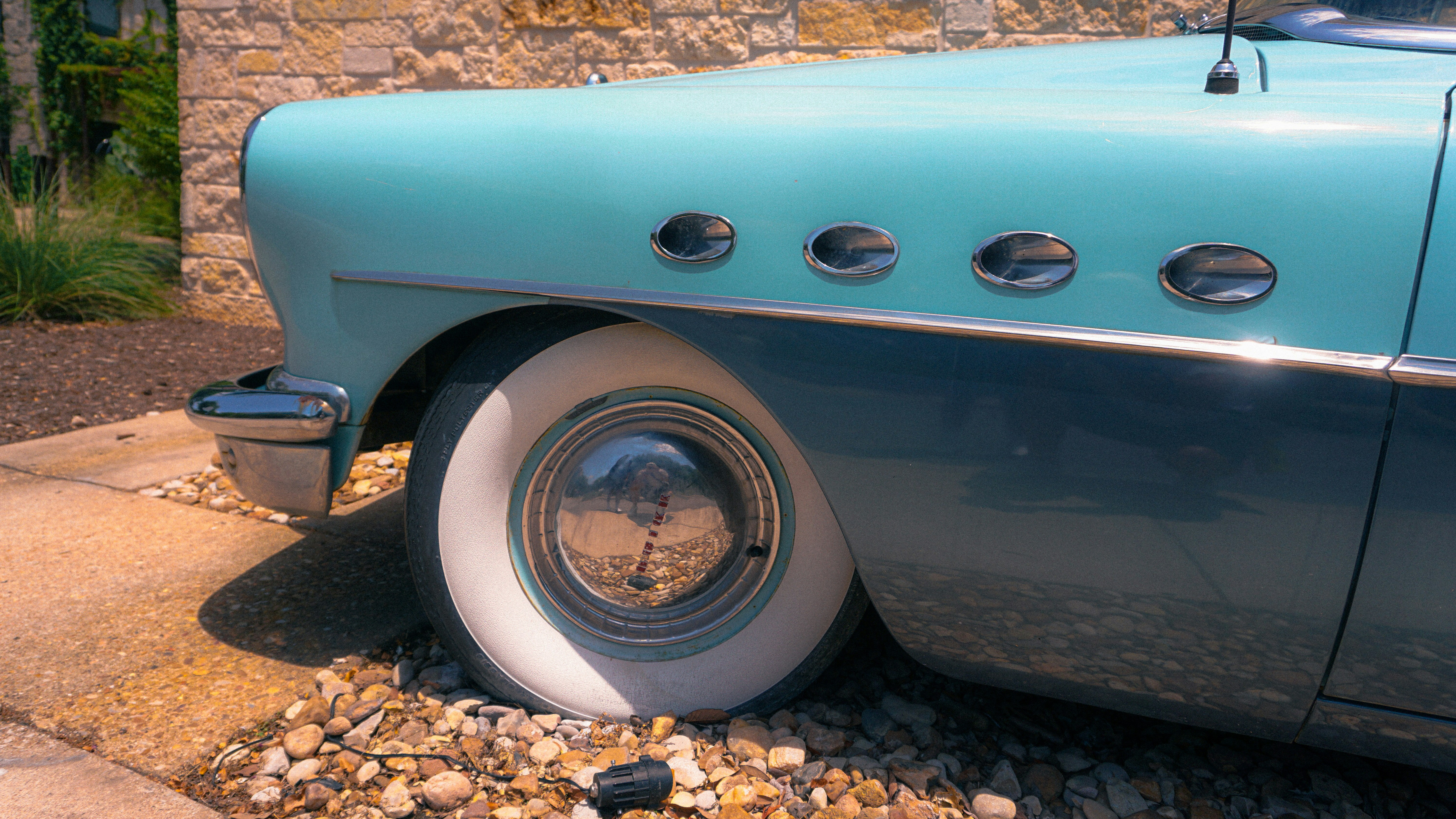 Pastel Chrome: A Crystal-Clear Glimpse of a Classic Buick’s Hood Fins
