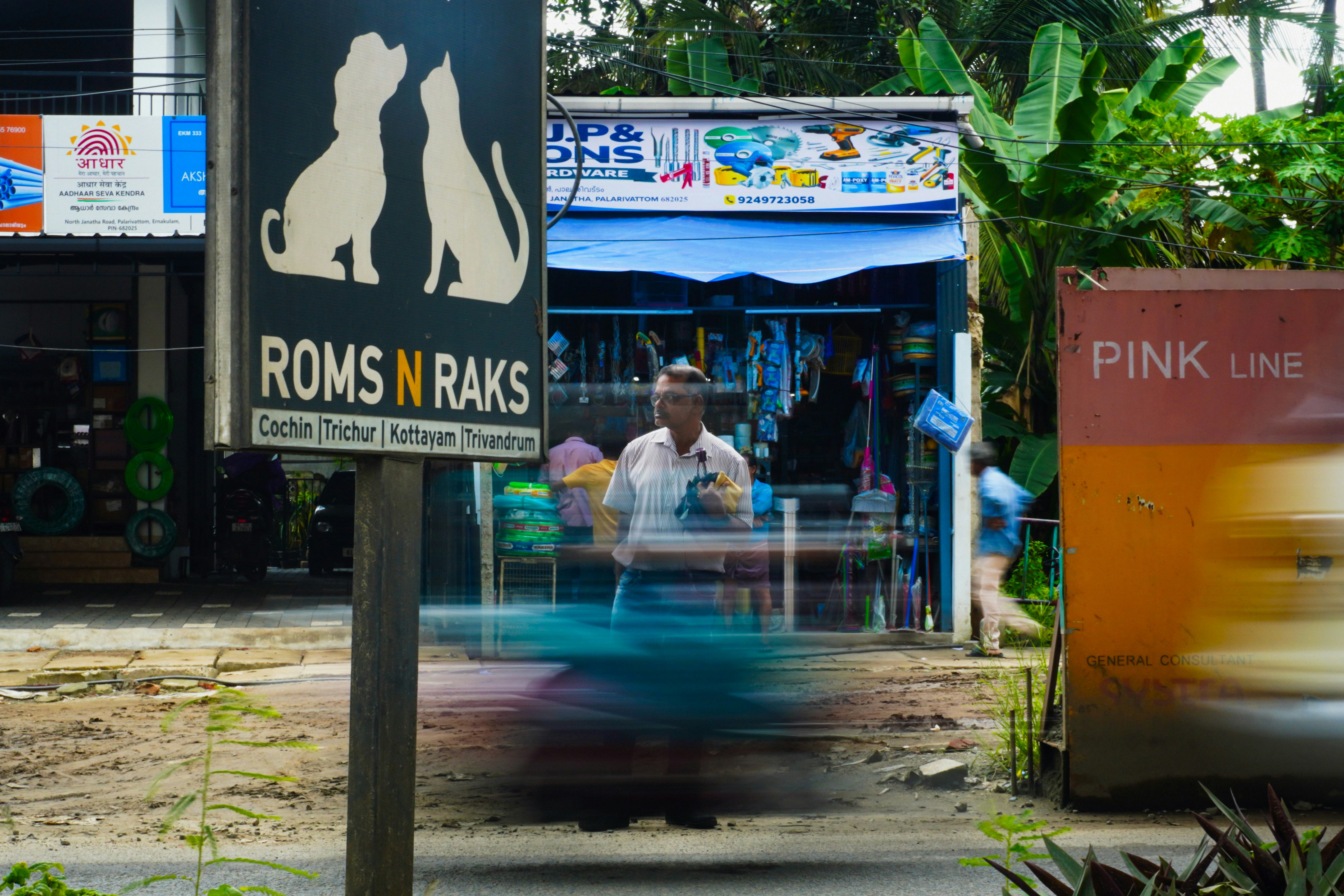 Signpost of Silhouettes: A Busy Street Scene in Motion