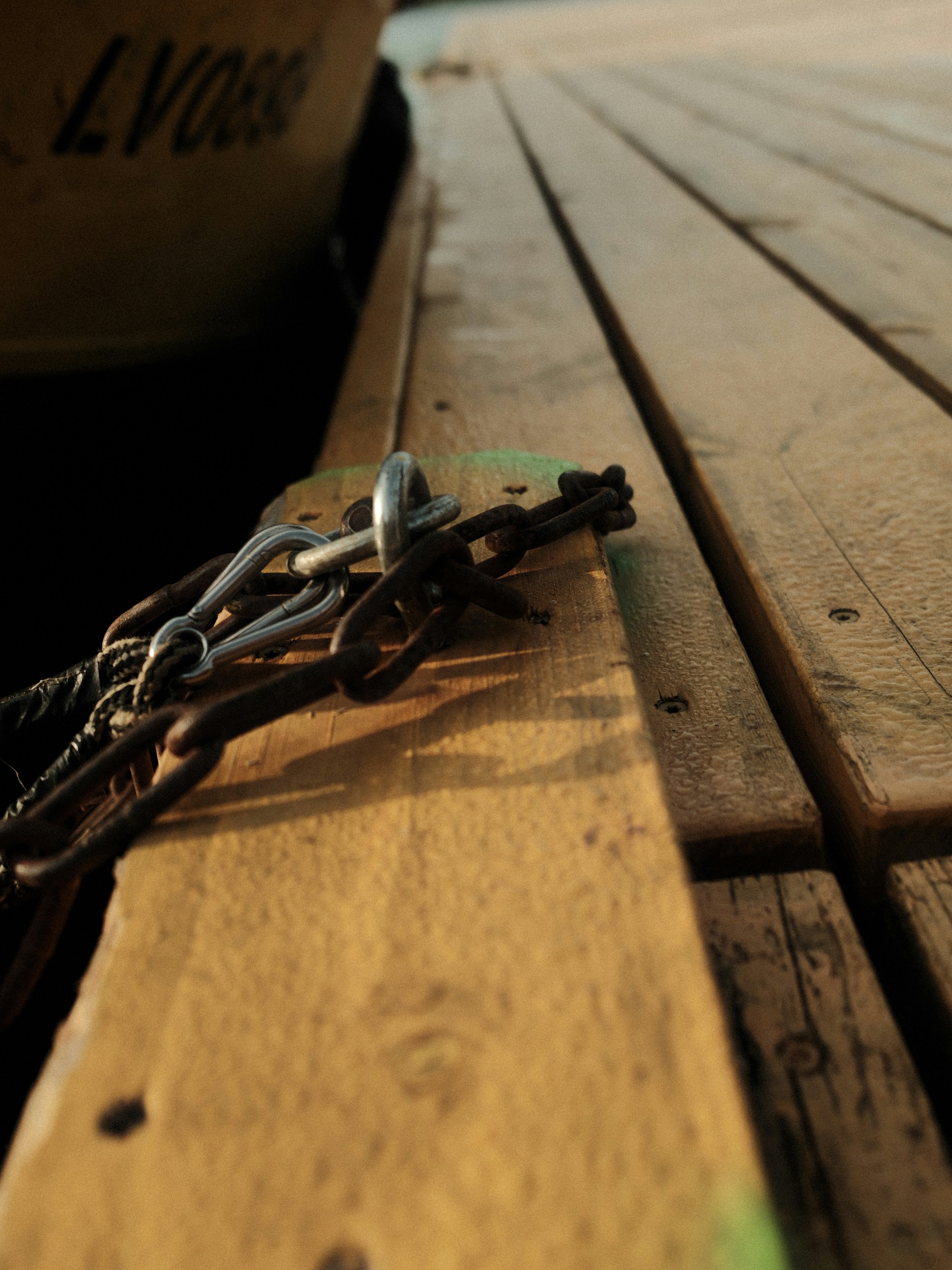 Rusted Chain and Wood on a Quiet Dock