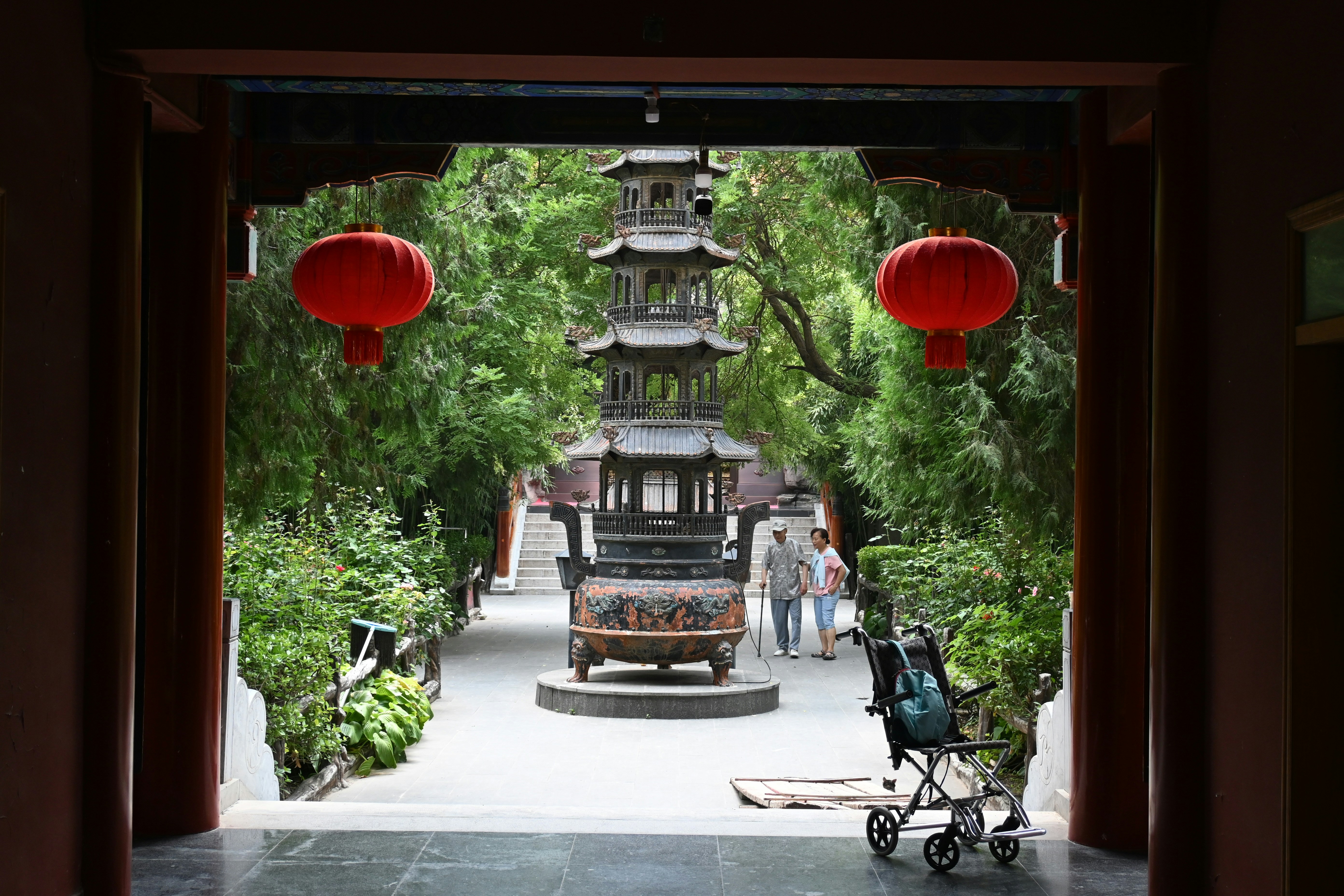 Lanterned Gateway to Serenity: Vue of a Central Pagoda in a Lantern-Frame Courtyard