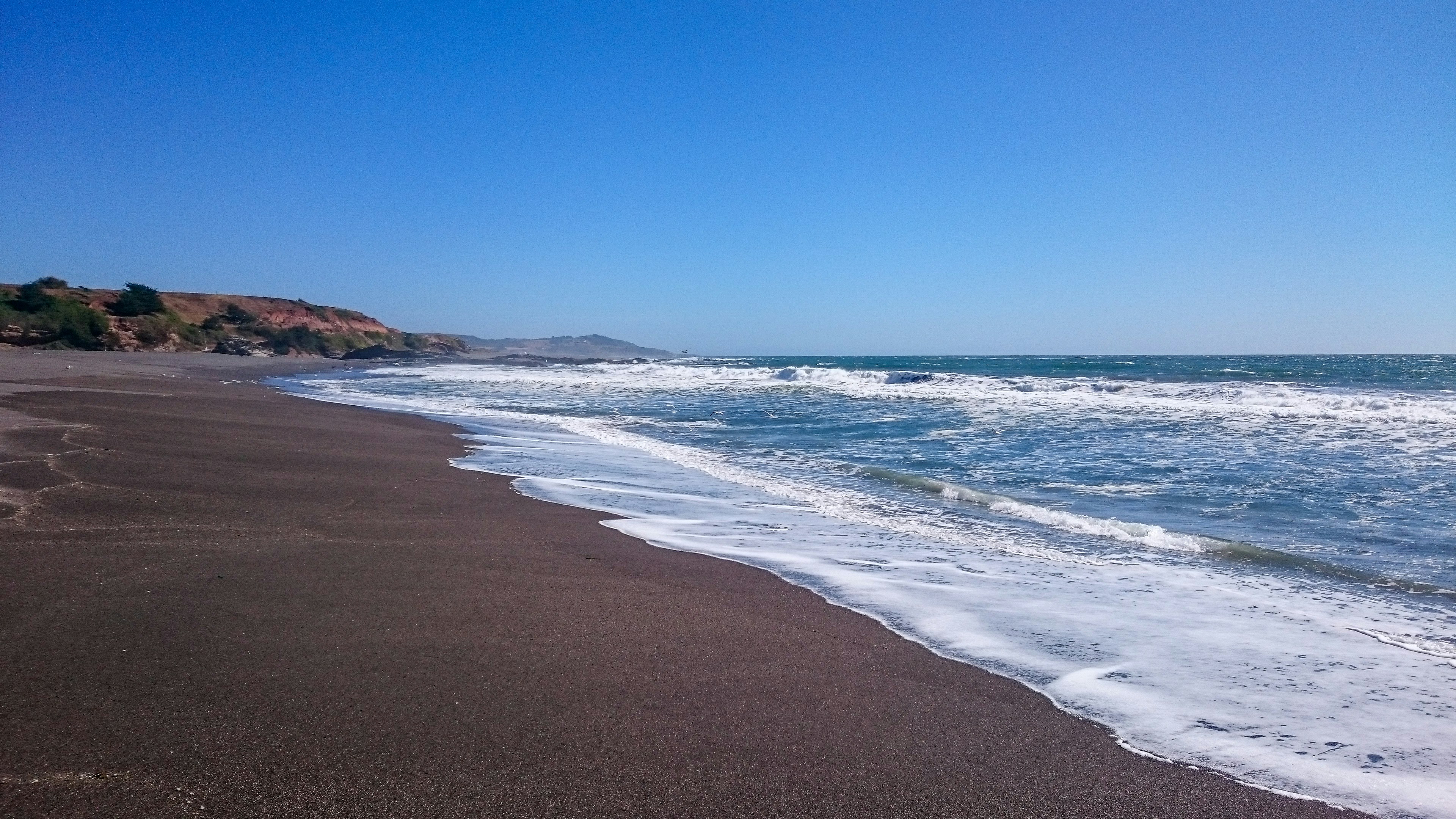 Coastline in Early Light: Wave Crest Meeting Sand