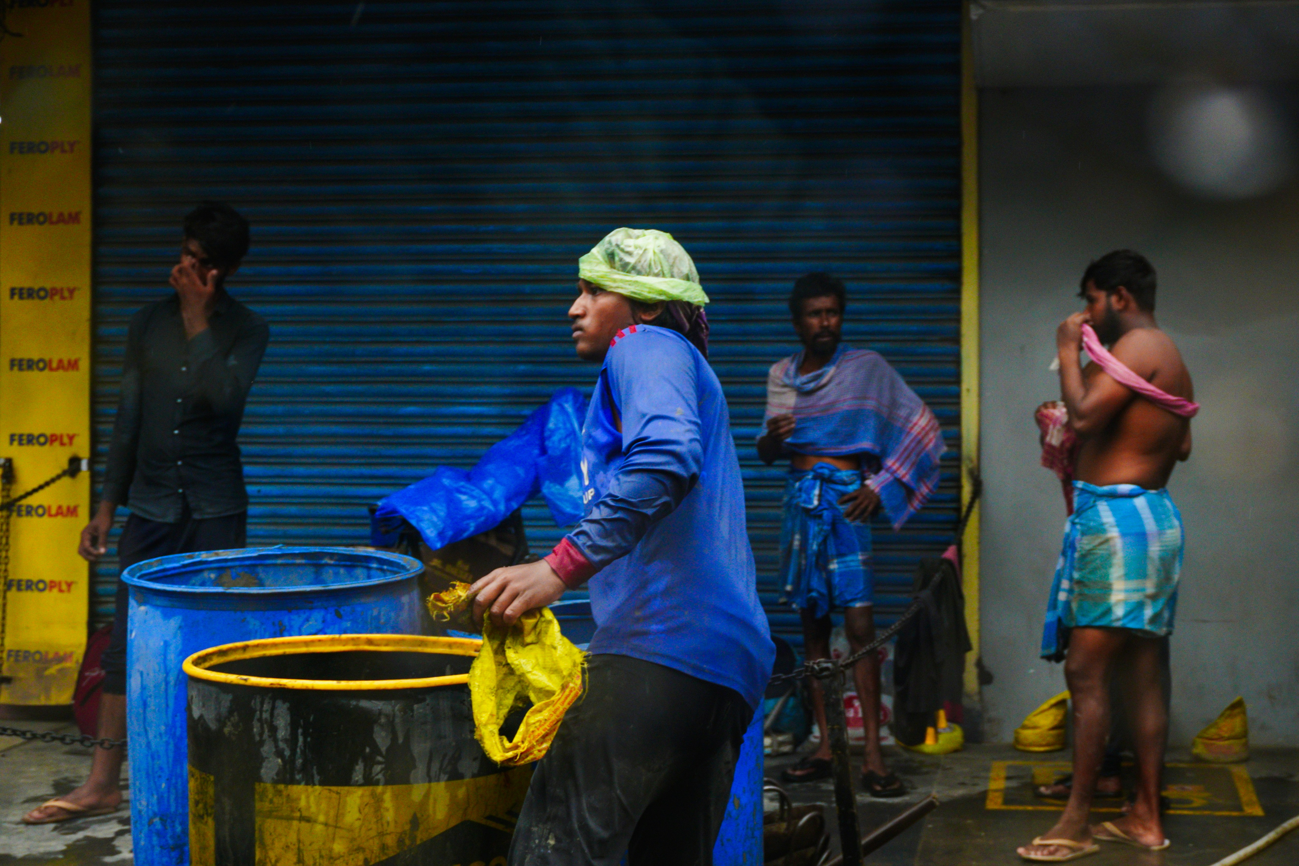 Washing the Street: A Volunteer’s Quiet Labor Amid Urban Afterlife