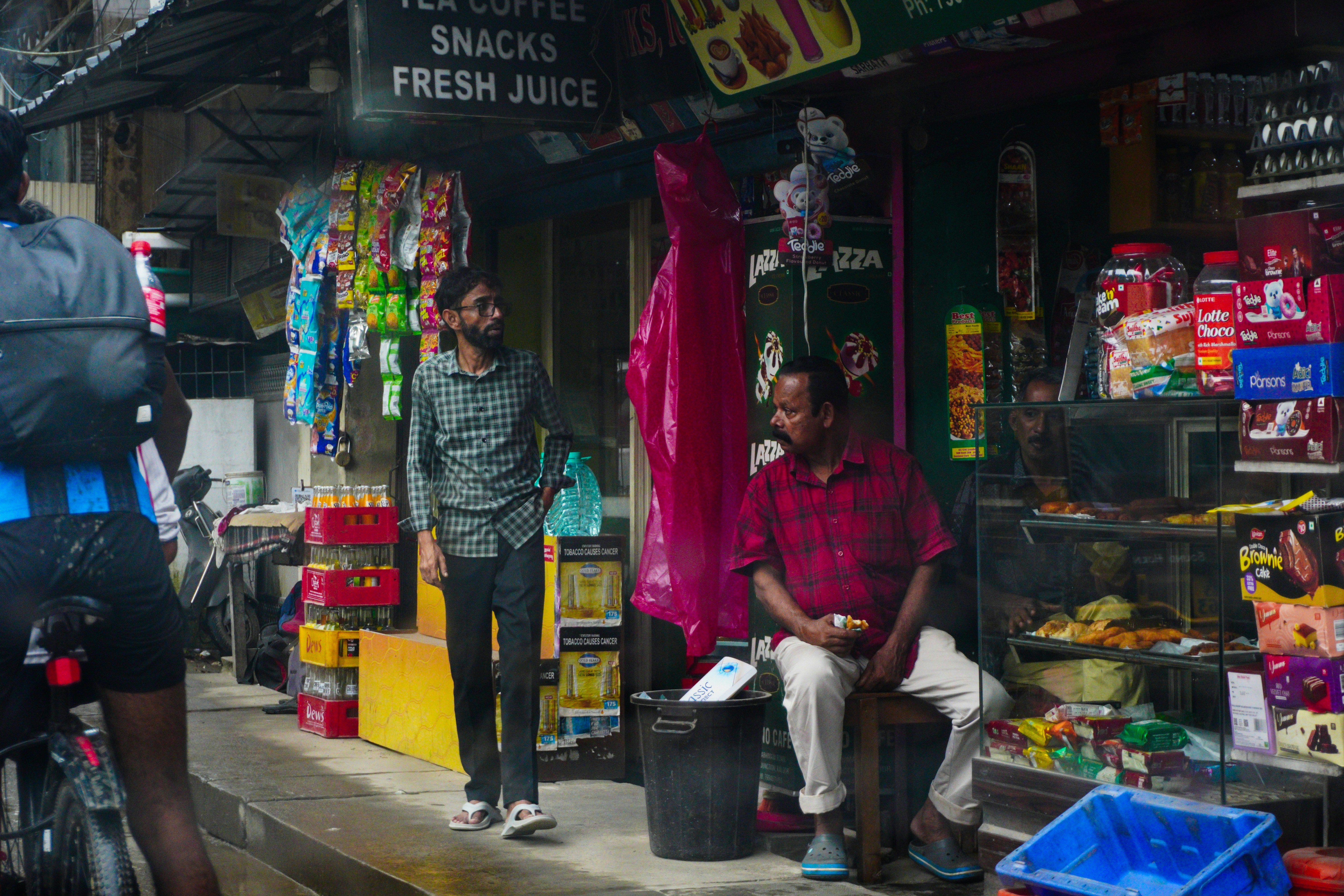 Street Corner Portrait: Two Men in a Busy Indian Market