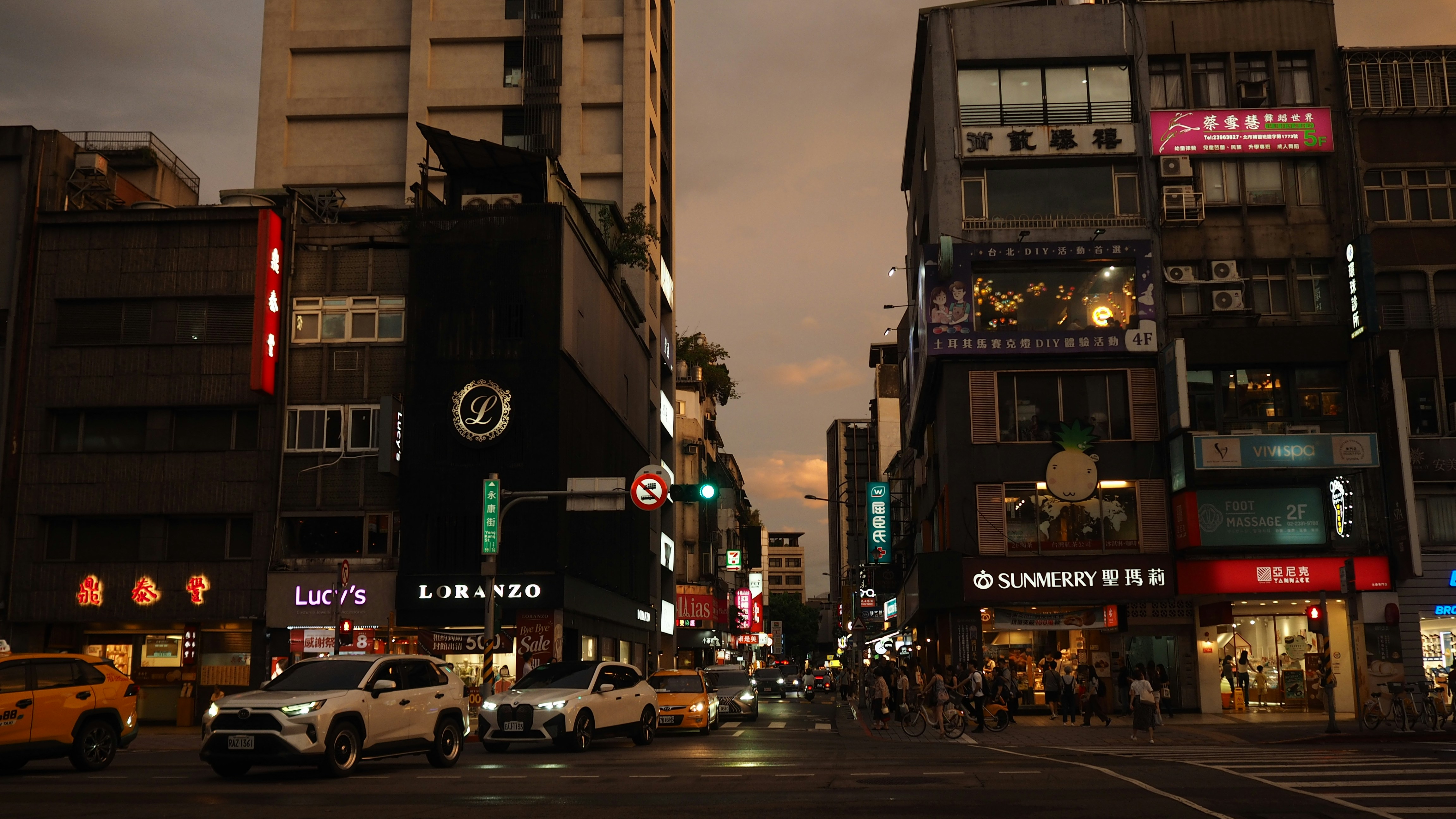 Neon Alley Confluence: Cars, Pedestrians, and City Lights