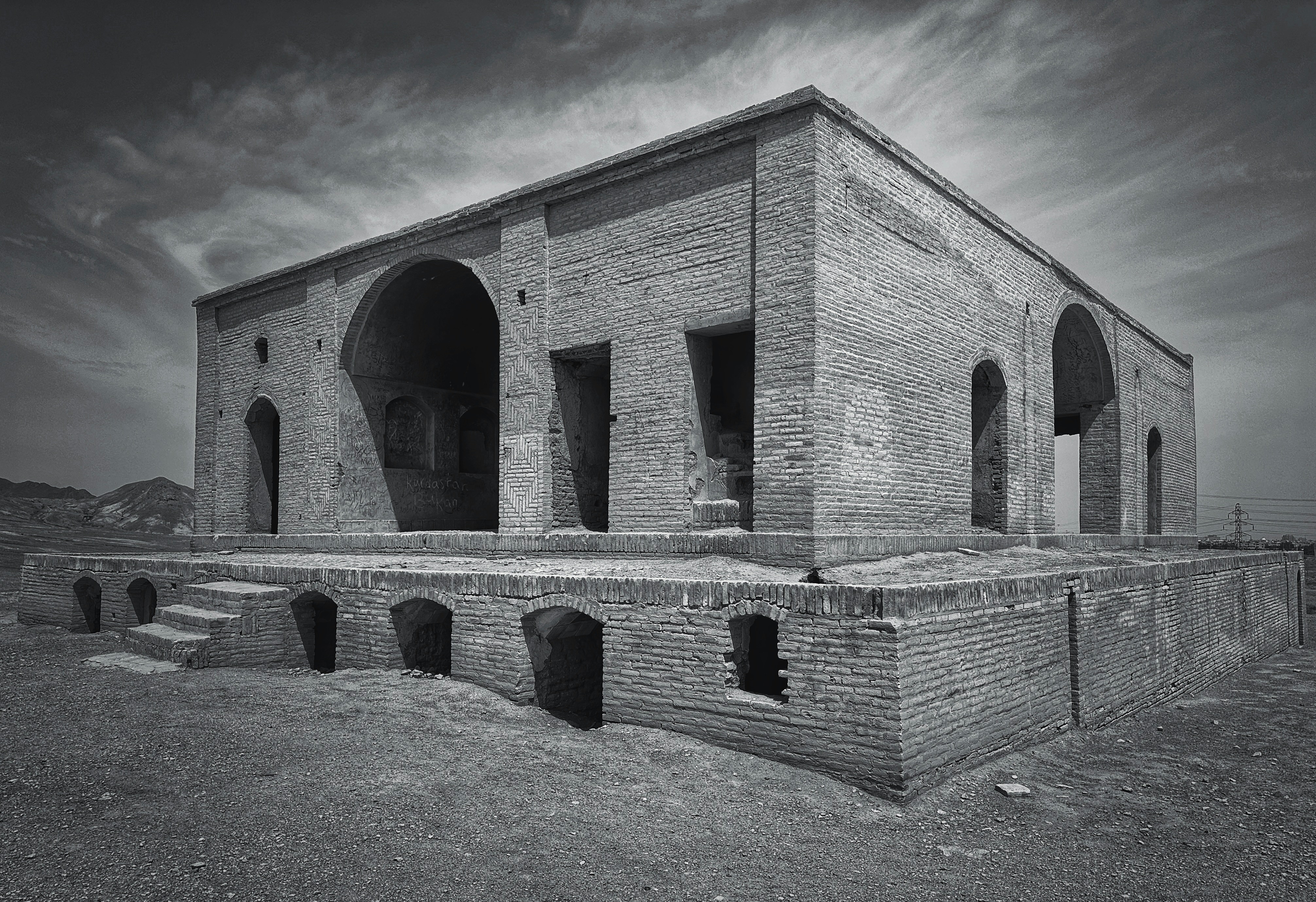Desert Ruin in Monochrome: A Brick Arched Monolith