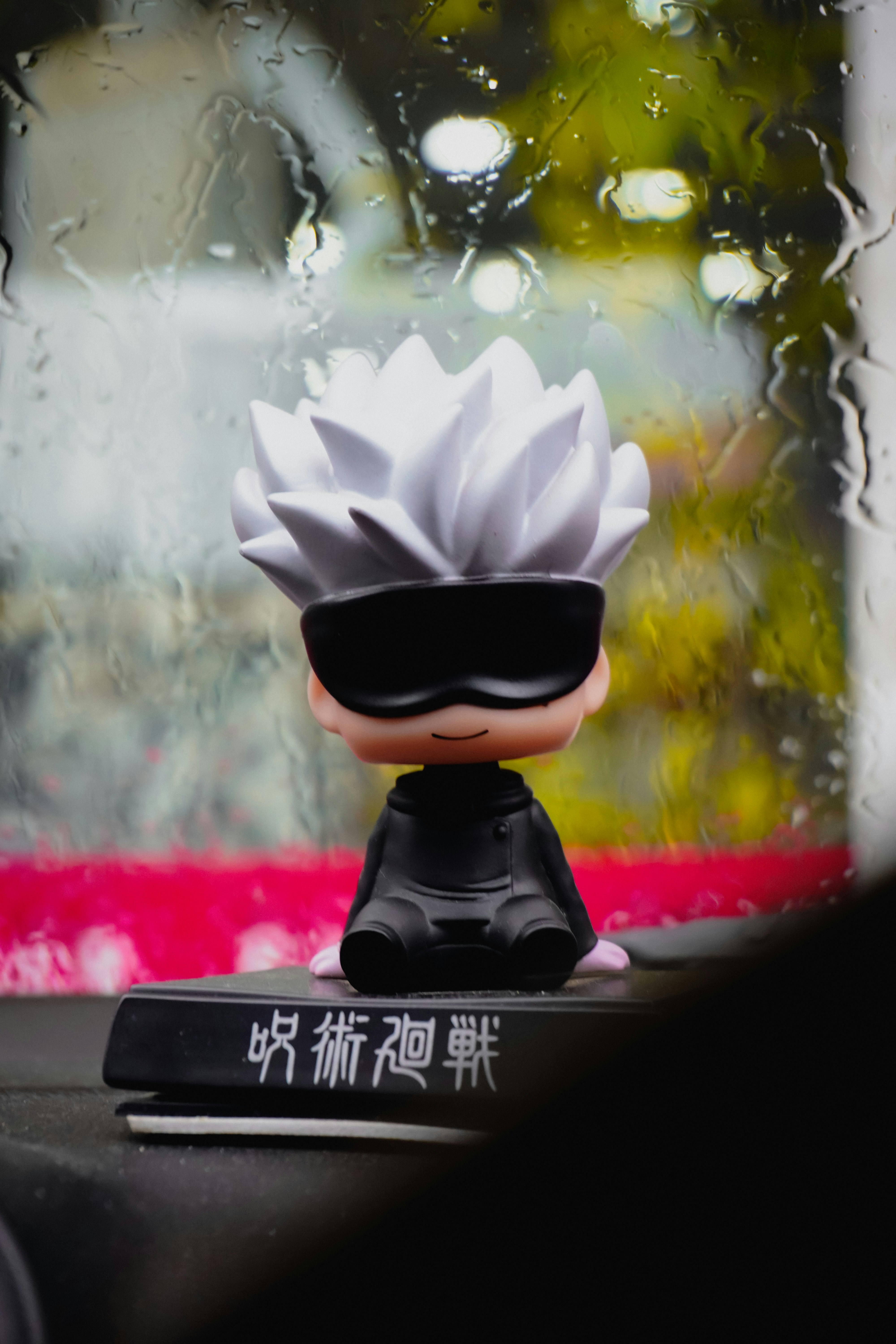 Zen Plume: A Tiny Figure in a Rain-Splashed Window