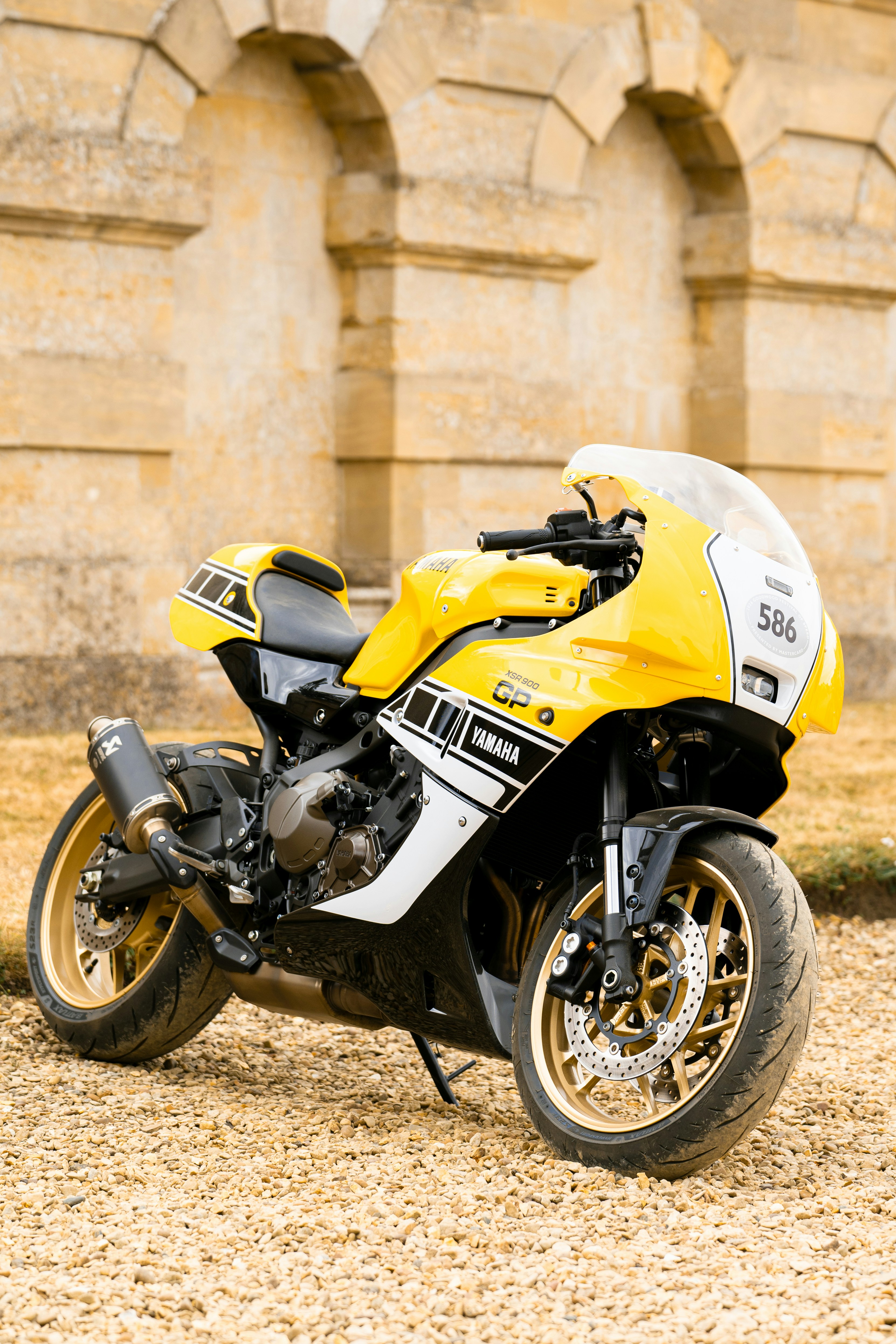 Golden Yamaha Chopper Halted Before Stone Arches