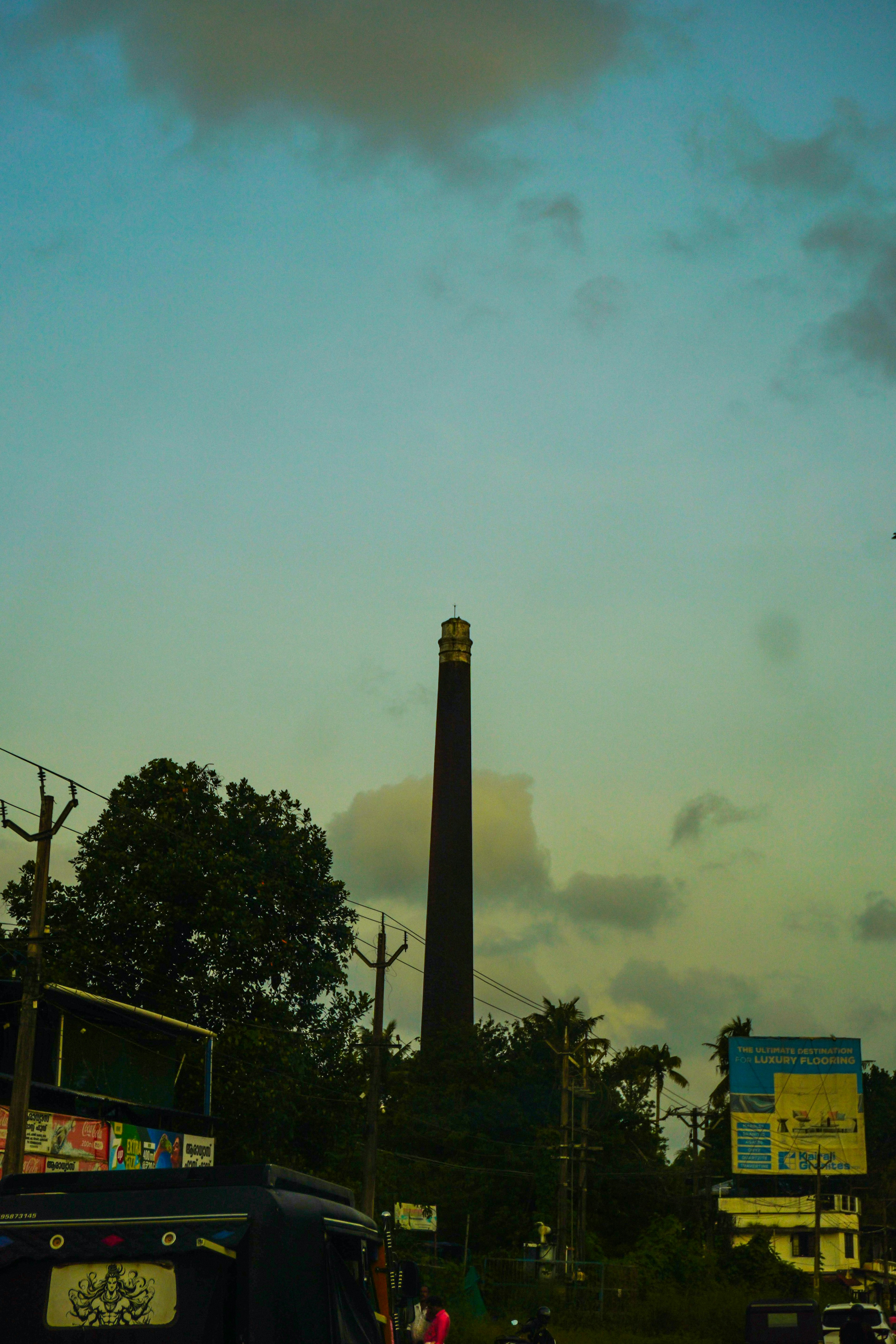 Lone Chimney Sentinel in a Quiet Urban Twilight