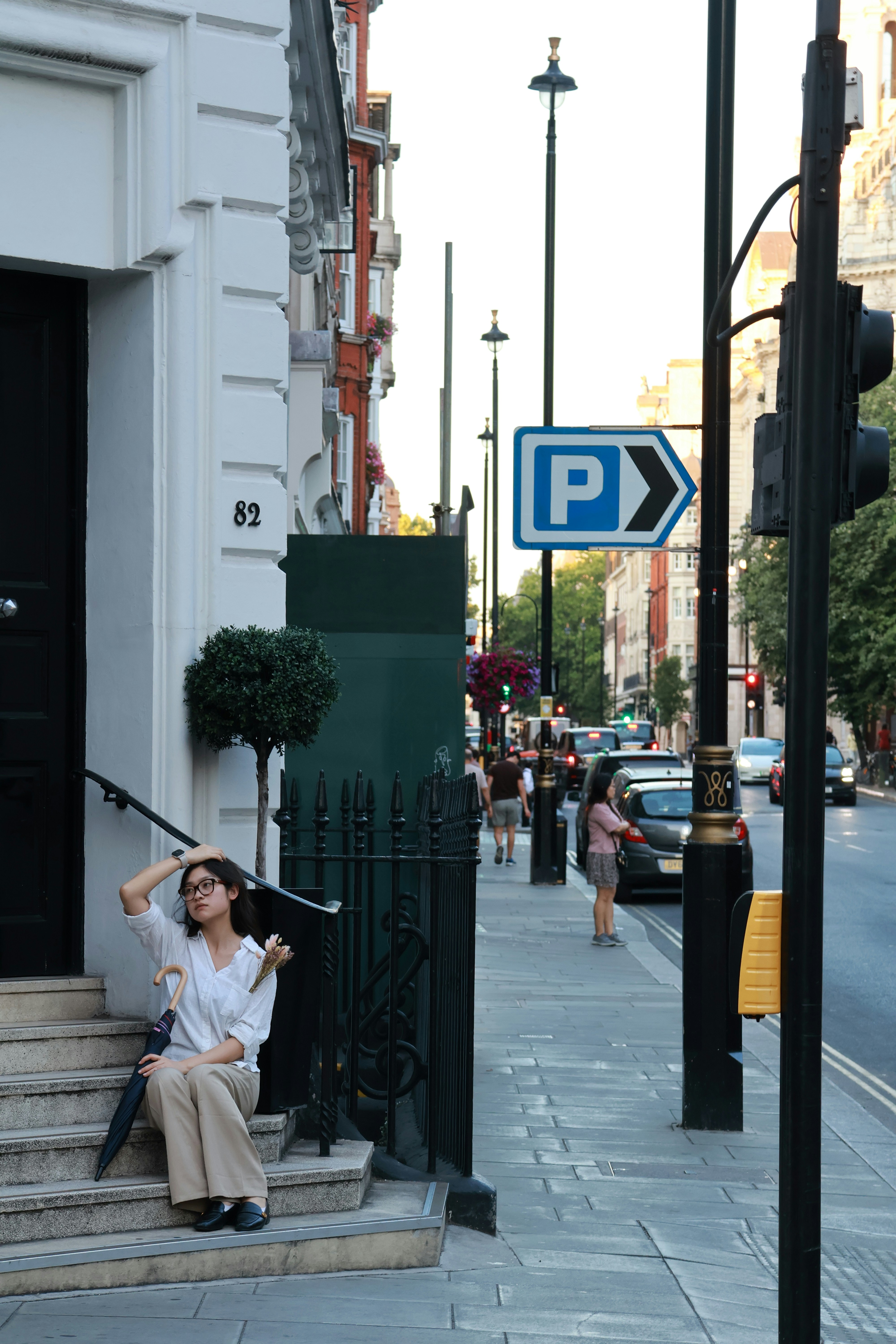 City Steps and Street Sign: Quiet Moment at a Busy Corner