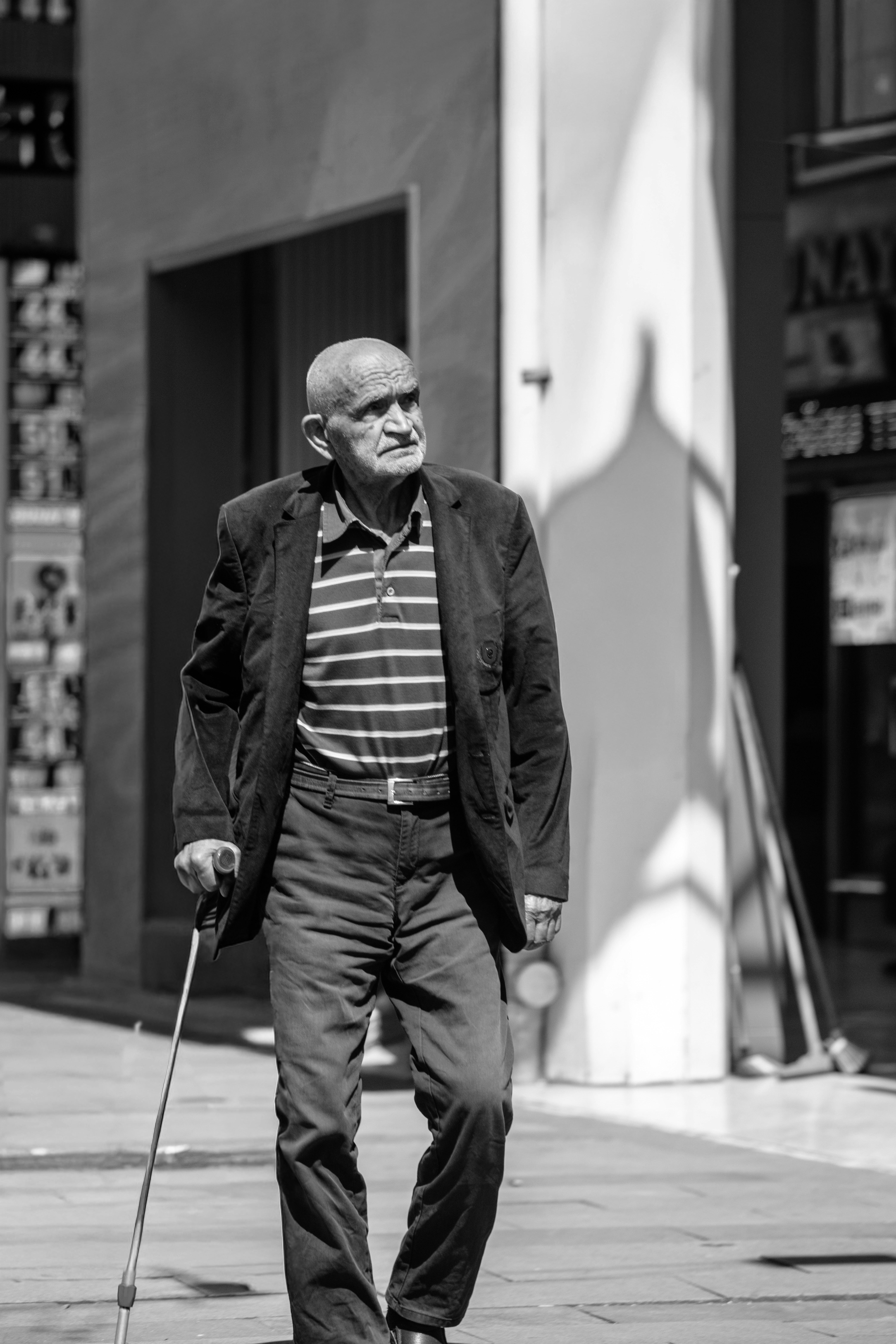 Anchored Steps: An Elder Walker in the Urban Light