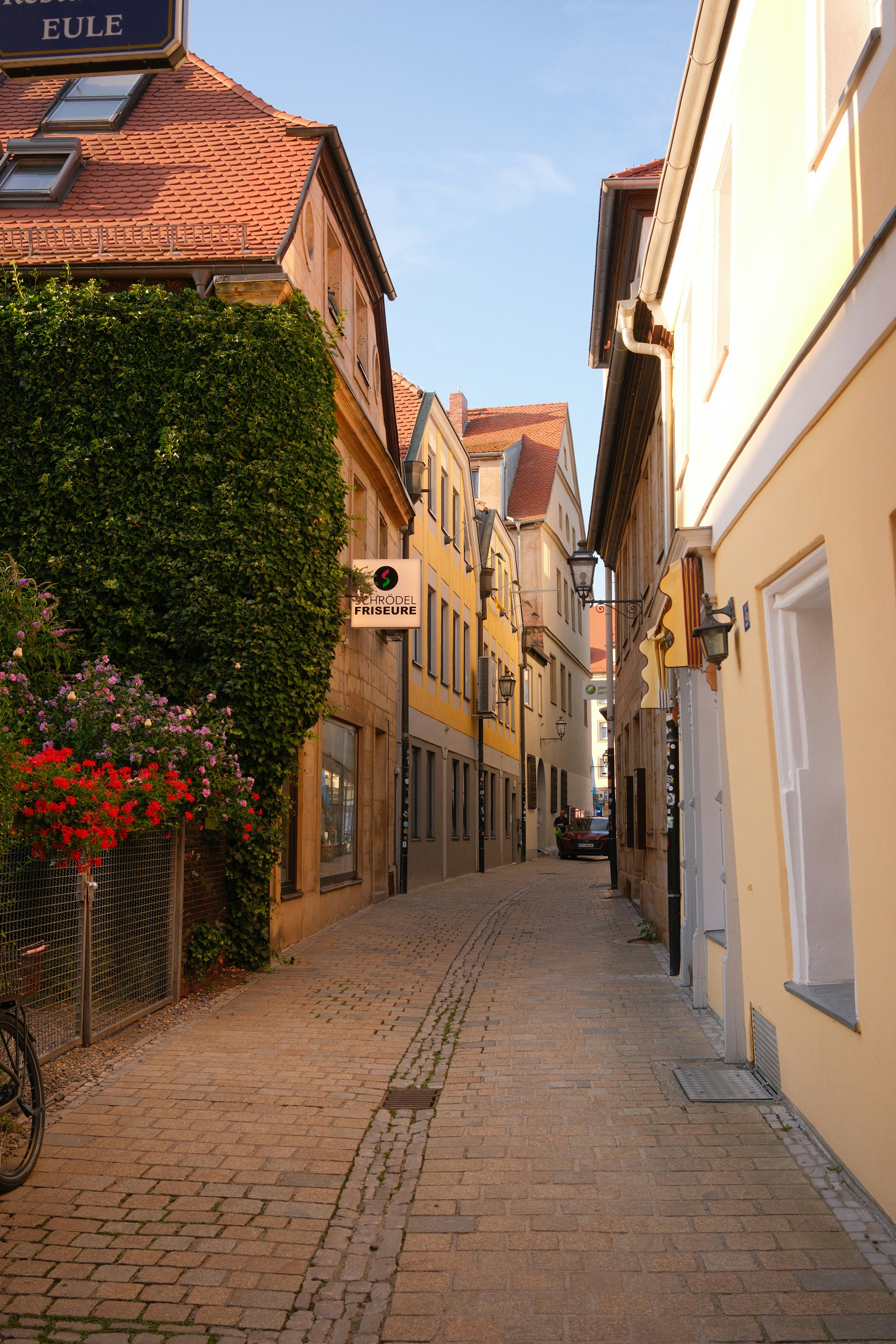 Cobbled Alleyway Between Whimsy of Colorful Facades
