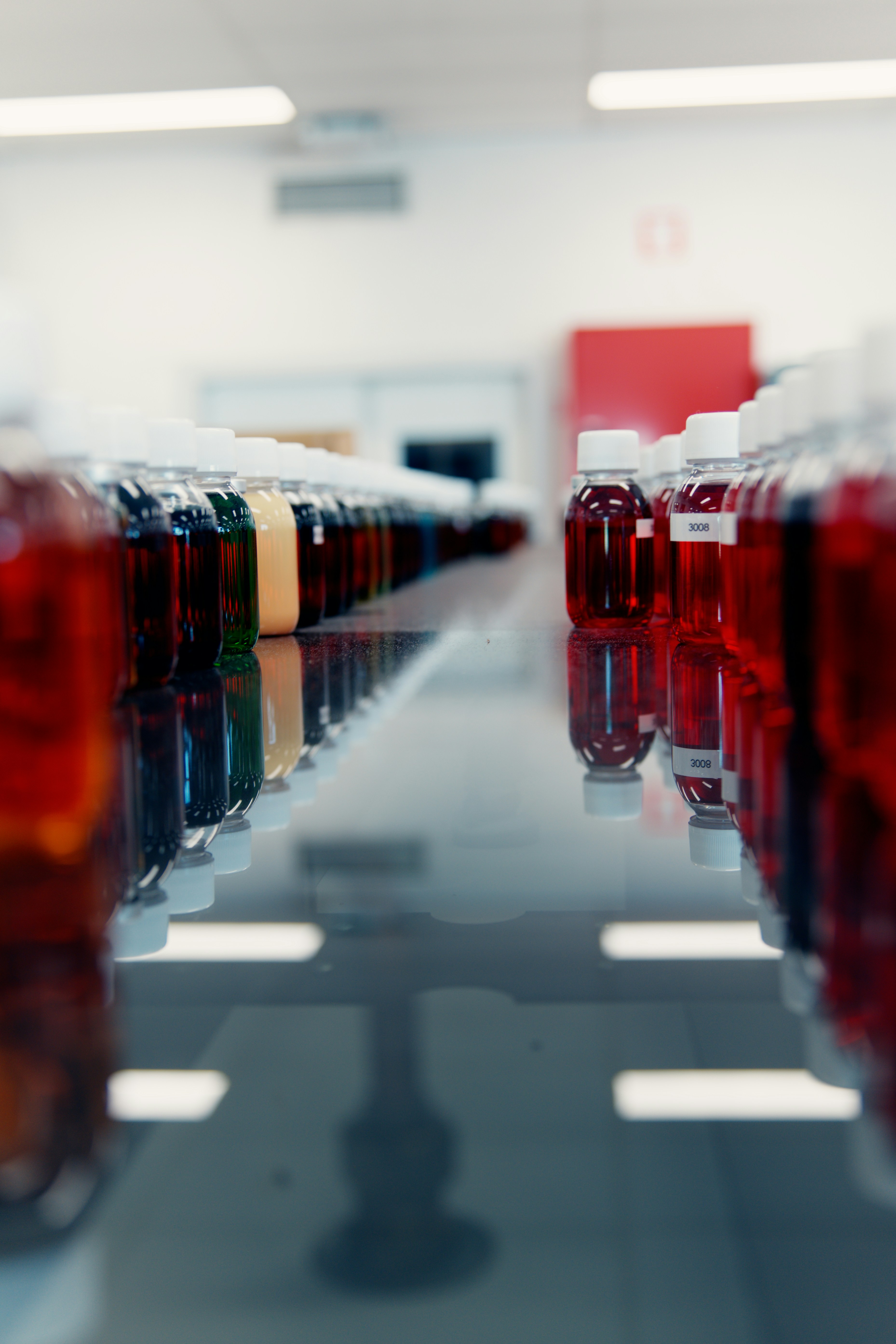 Symmetry in Glass: Bottled Rows Reflected