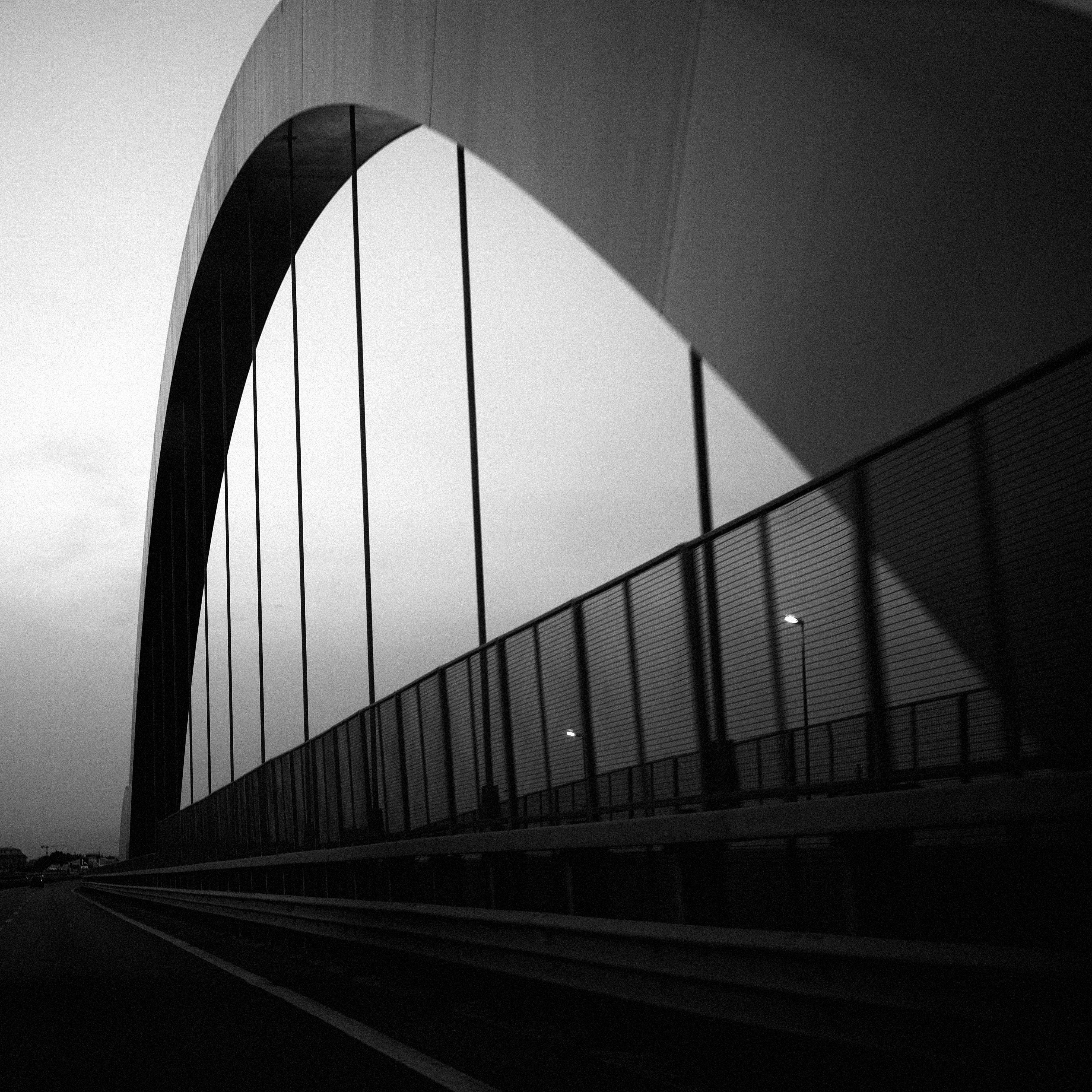 Monolithic Arch: A Monochrome Bridge Tracing Shadows