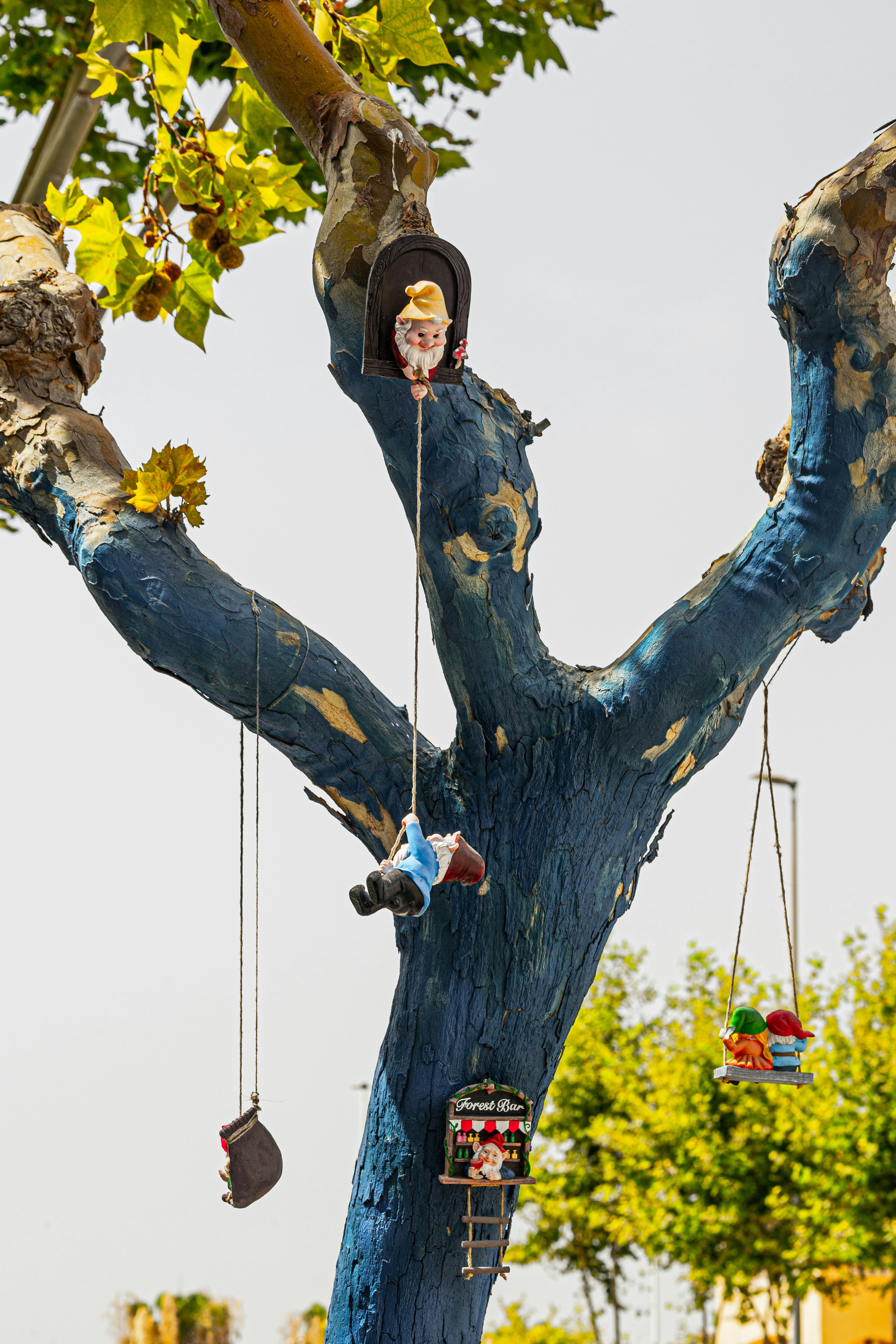 Nostalgic Treetop Miniatures: a Tiny World on a Painted Tree