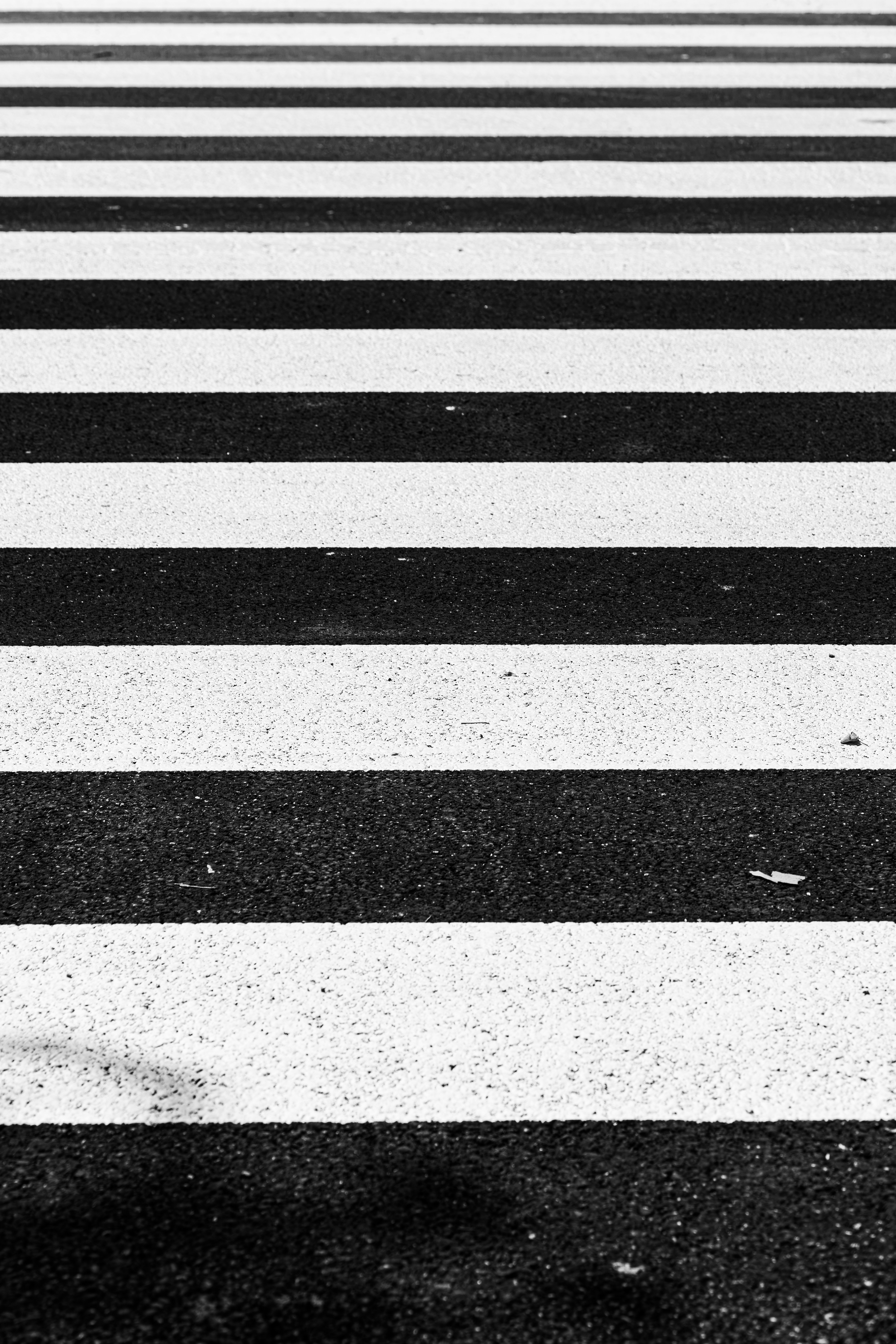 High-contrast black-and-white stair-step pattern captured in stark, static lines; the image emphasizes rhythm and texture in an abstract, architectural detail.