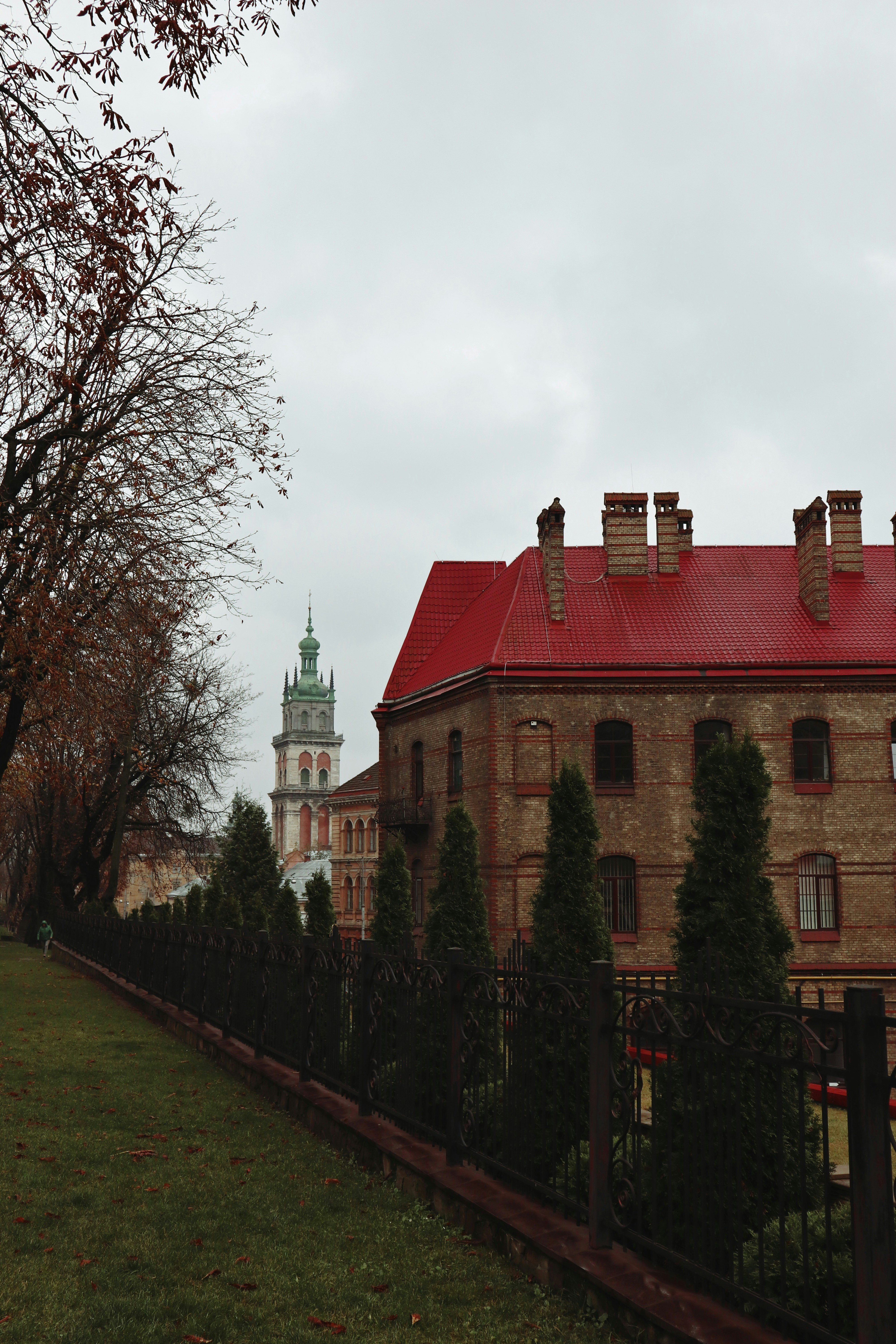 Red Roofs and Clock Tower: A Quiet Street through a Historic Campus