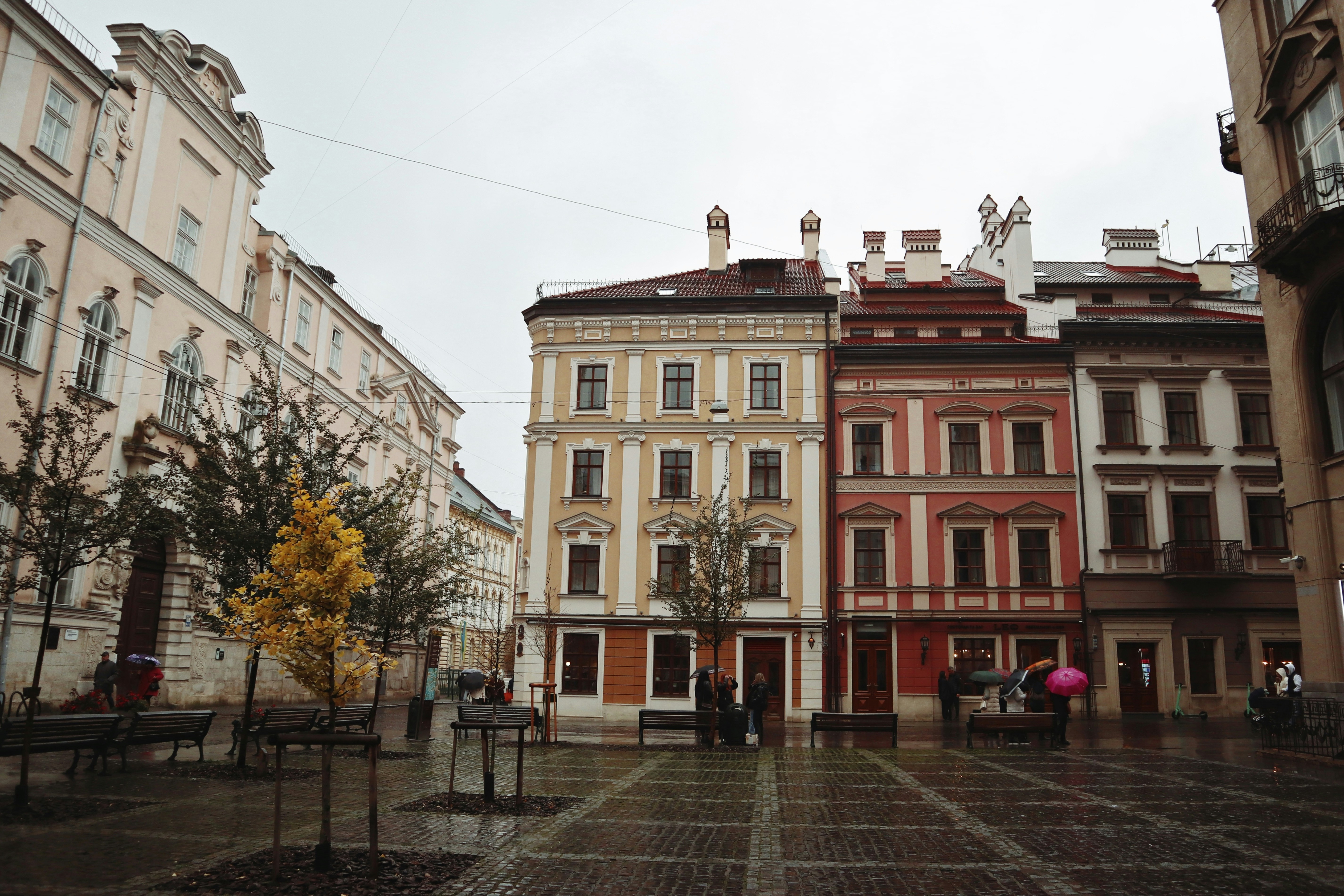 Colorful Facades in a Rainy City Square